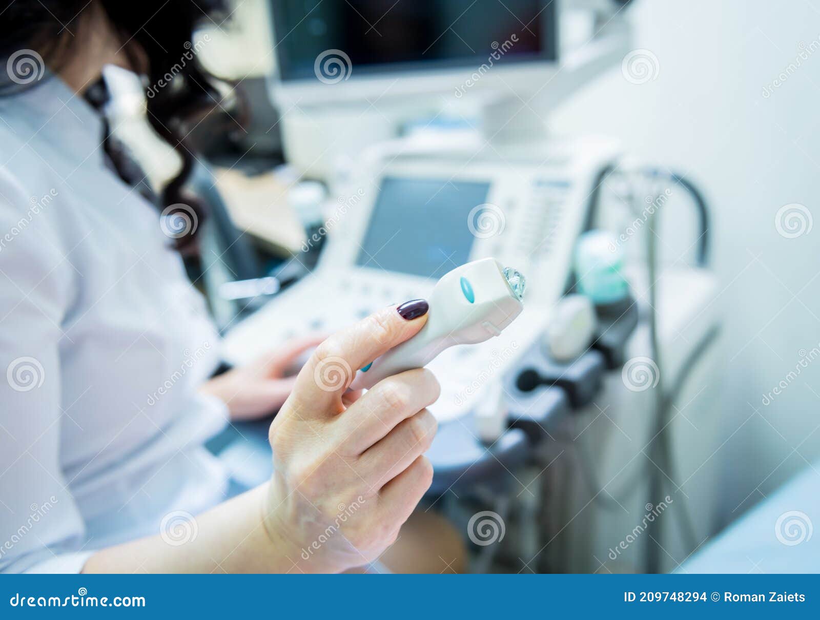 Doctor Using Ultrasound Scanning Machine for Examining a Thyroid of ...