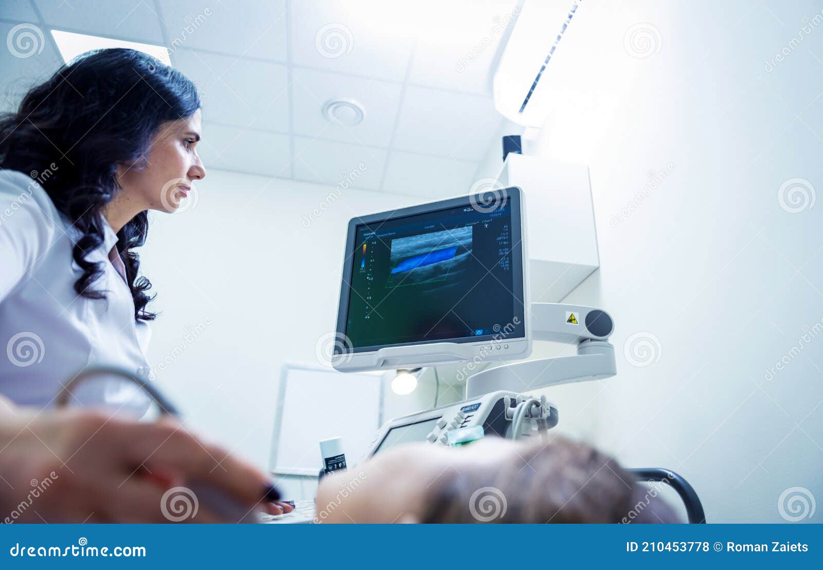 Doctor Using Ultrasound Scanning Machine for Examining a Thyroid of ...