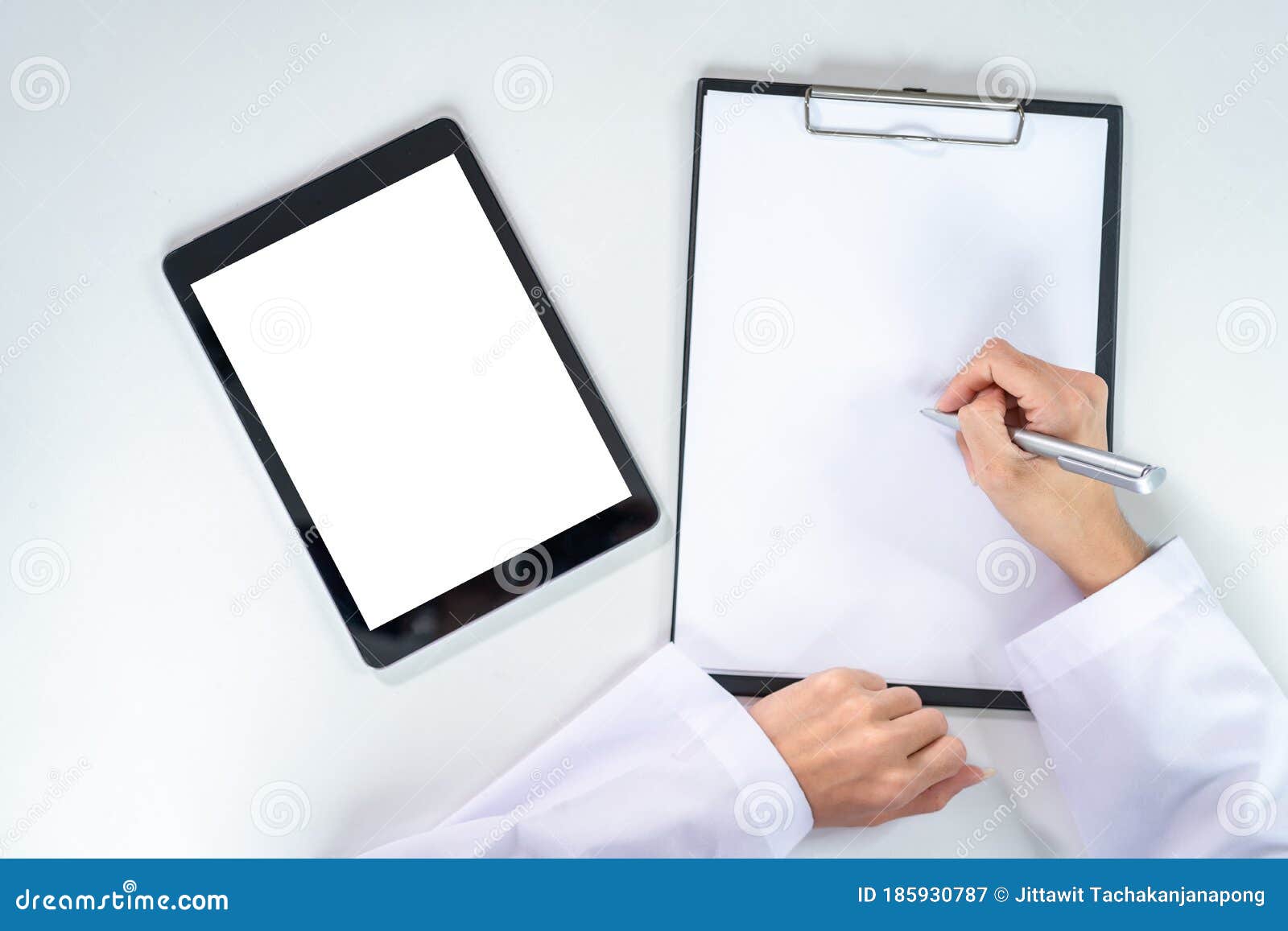 The Doctor Was Taking Notes in the Patient Data File Folder Stock Image ...