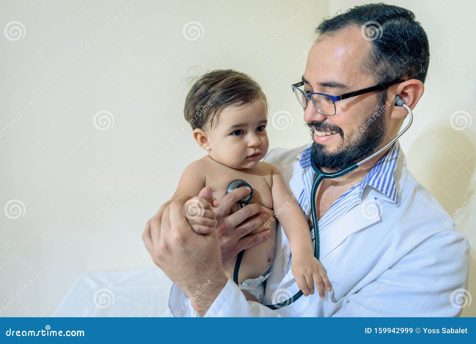 Doctor watching a baby stock image. Image of infant - 159942999