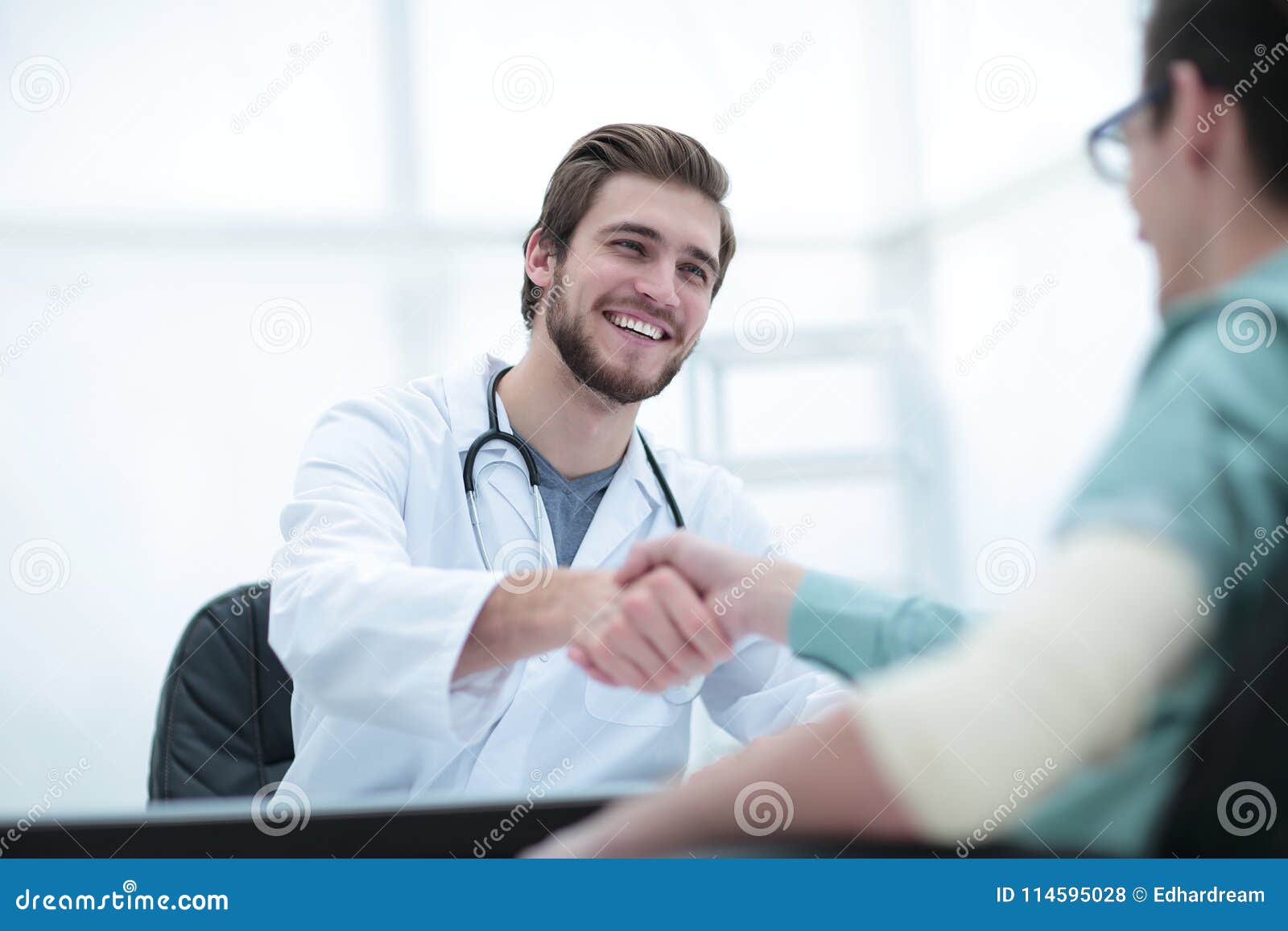 Doctor Welcoming a Patient in His Studio Stock Photo - Image of ...