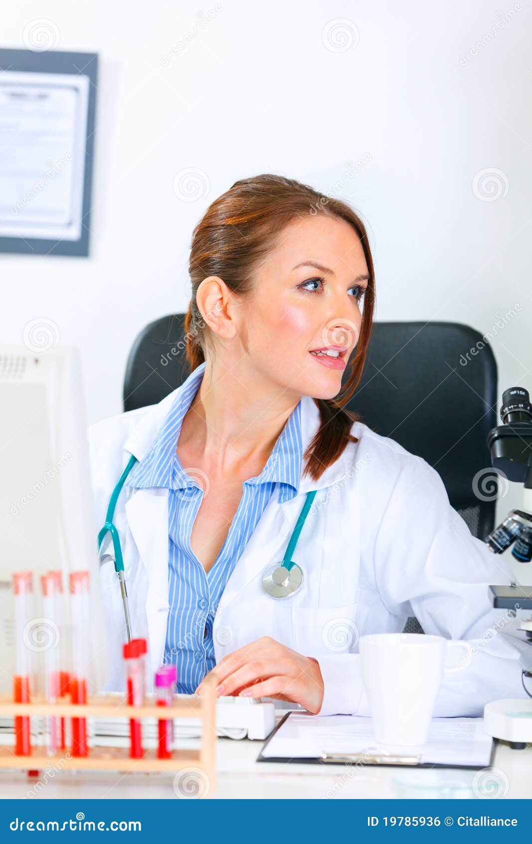 Doctor Woman Sitting at Table and Looking Away Stock Photo - Image of ...
