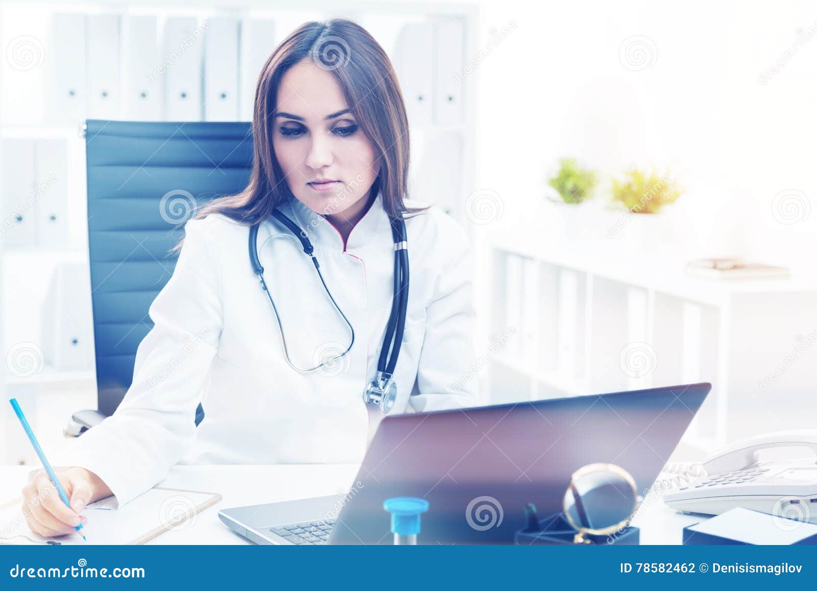 Doctor at work and writing stock photo. Image of effort - 78582462