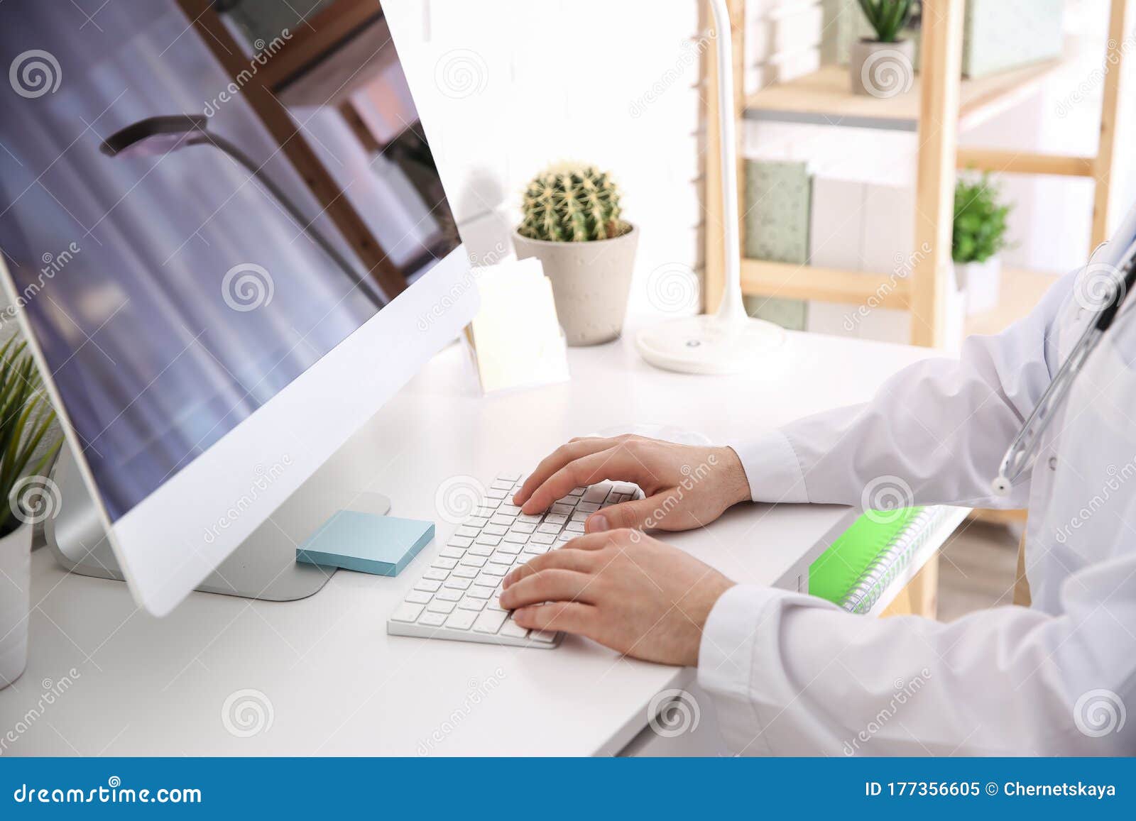 Doctor Working with Computer at Desk in Office Stock Image - Image of ...