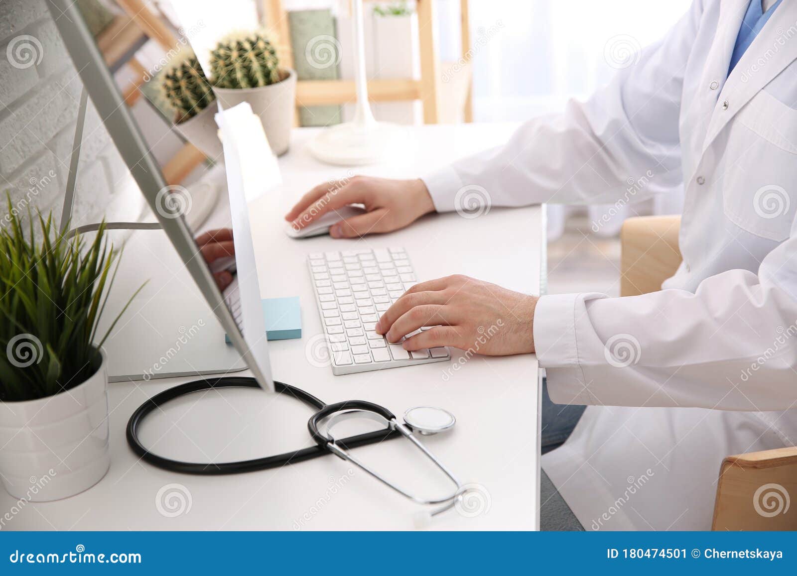 Doctor Working with Computer at Desk in Office Stock Image - Image of ...