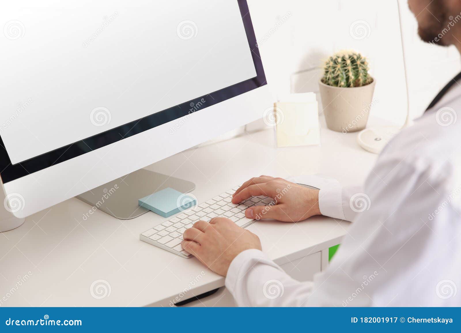 Doctor Working with Computer at Desk in Office Stock Image - Image of ...