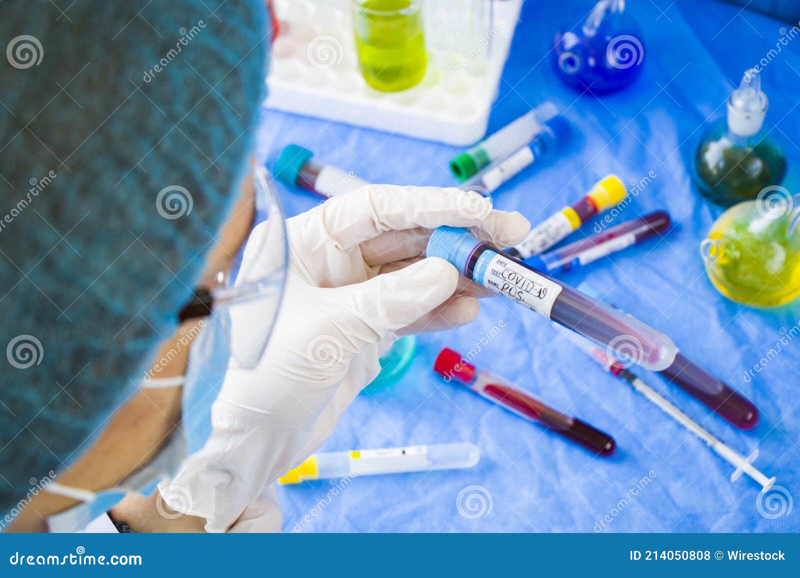 Doctor Working with Coronavirus Positive Test Samples in a Laboratory ...