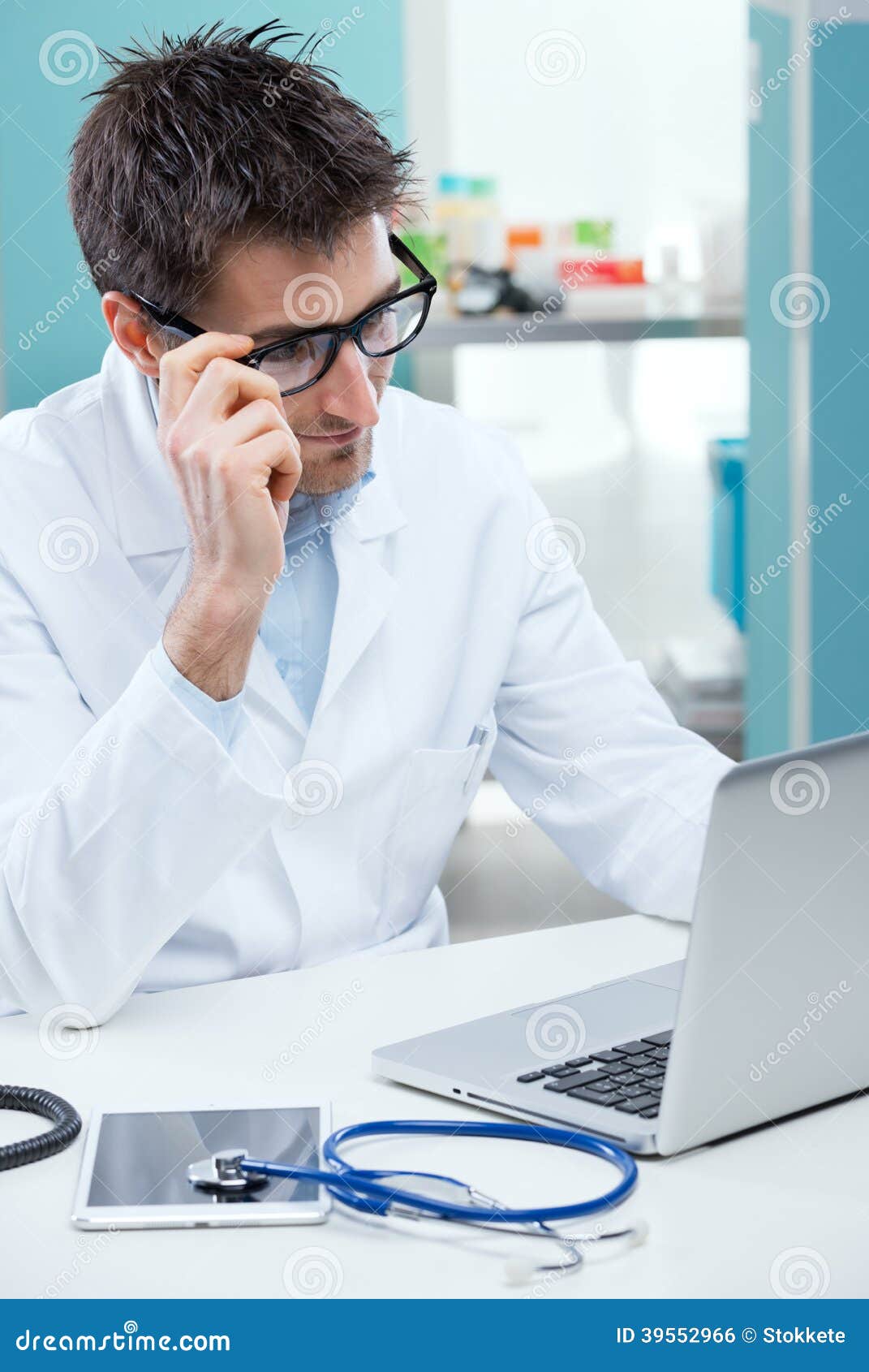 Doctor working at his desk stock photo. Image of doctor - 39552966