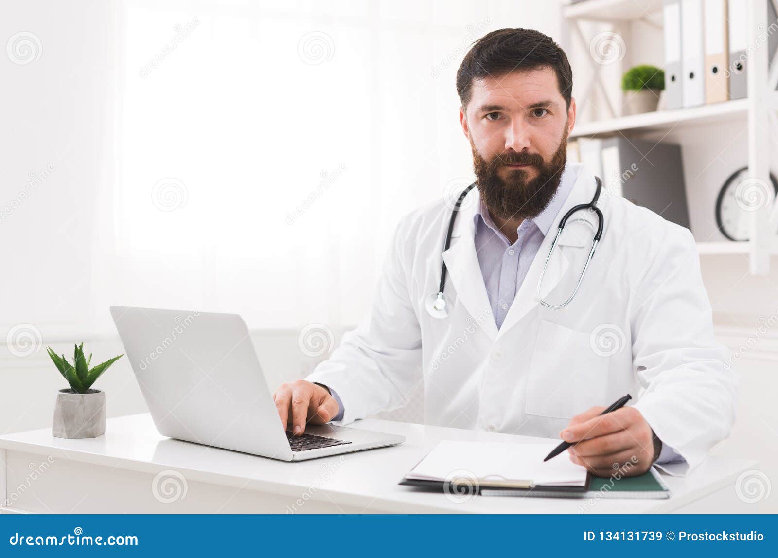 Doctor Working with Laptop Computer in Office Stock Image - Image of ...