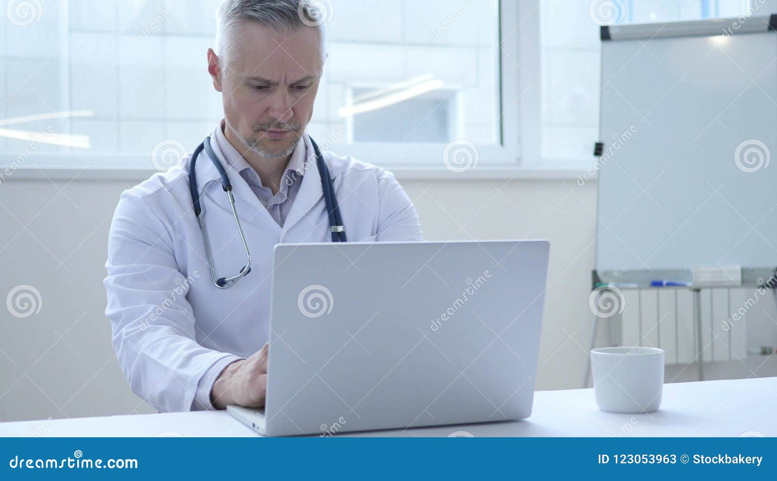 Doctor Working on Laptop stock image. Image of nurse - 123053963
