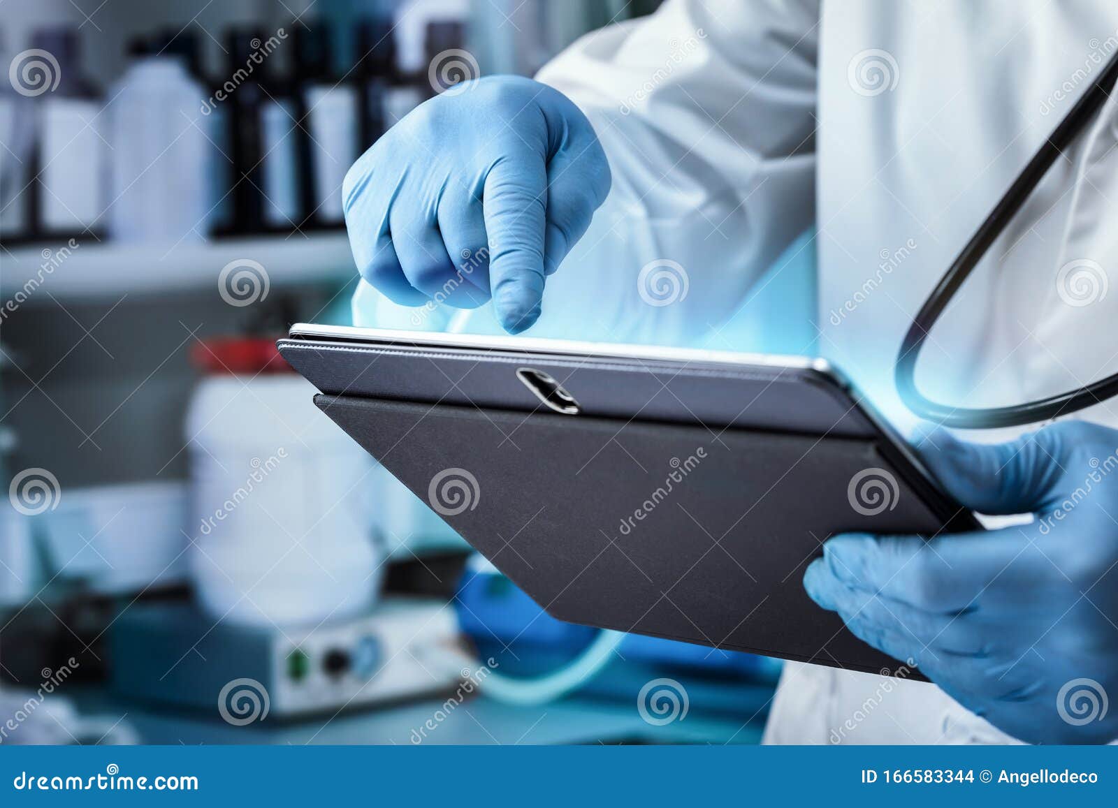 Doctor Working in Medical Software with Portable Computer in the ...