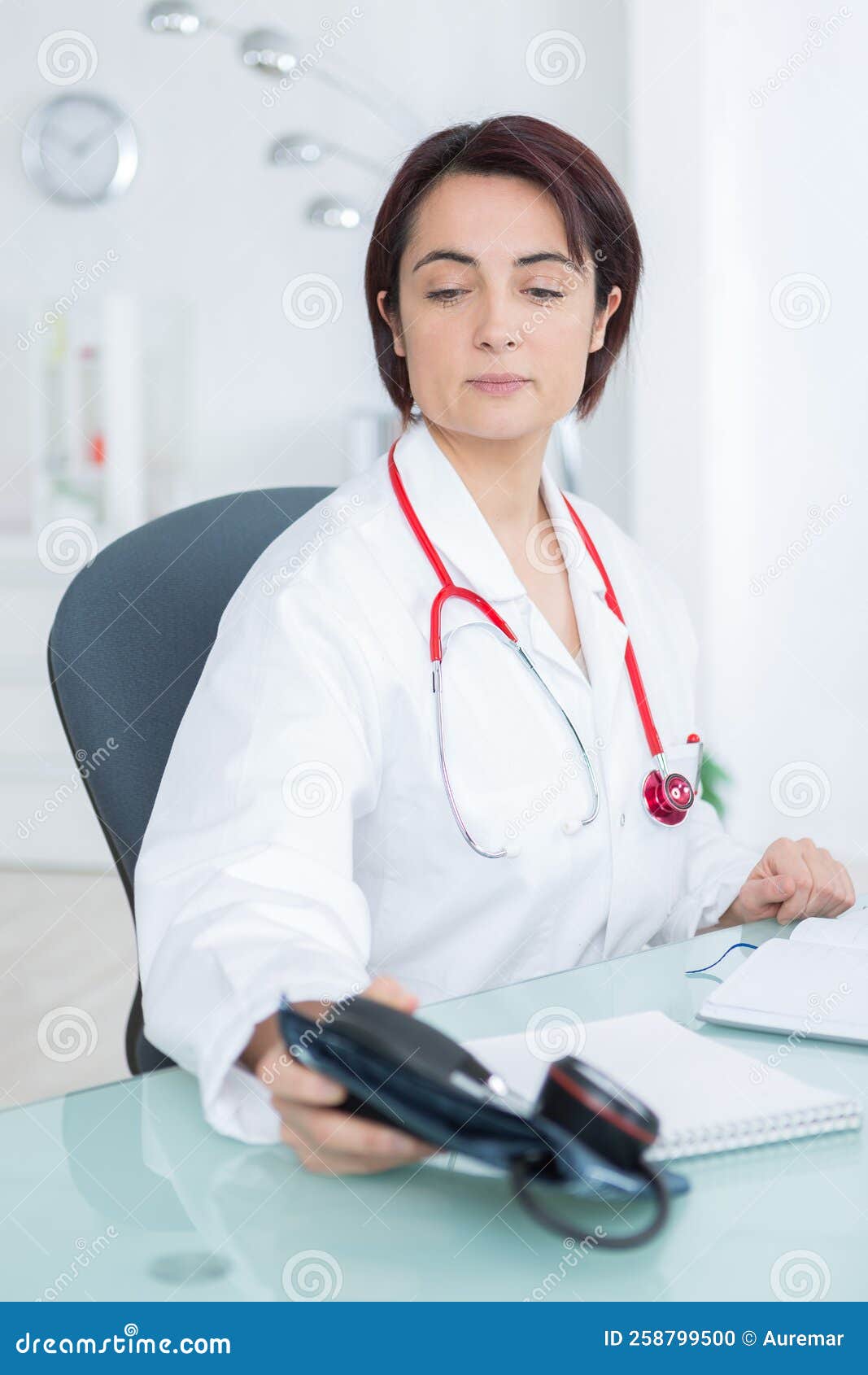 Doctor working in office stock photo. Image of clinic - 258799500