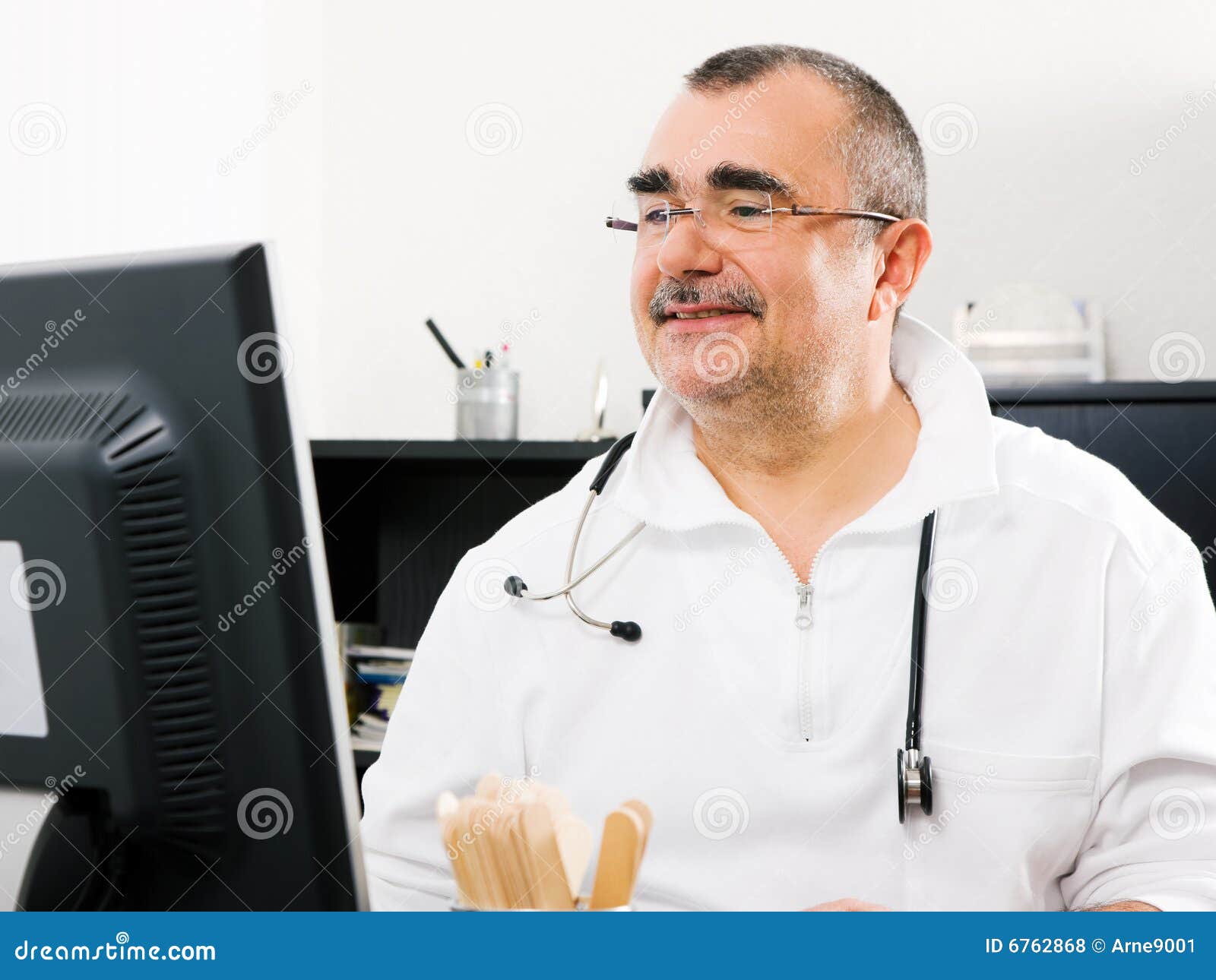 Doctor working at the PC stock photo. Image of physician - 6762868
