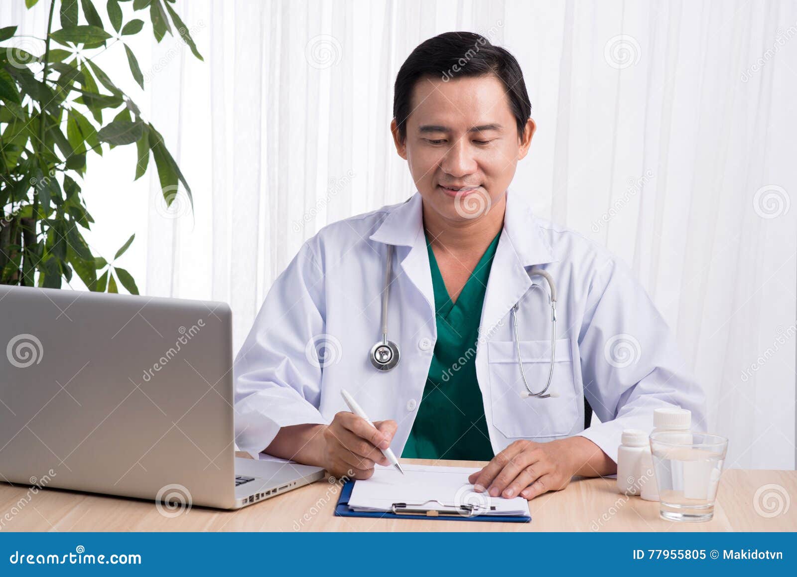 Doctor Working at Table in Office Stock Image - Image of indoors ...