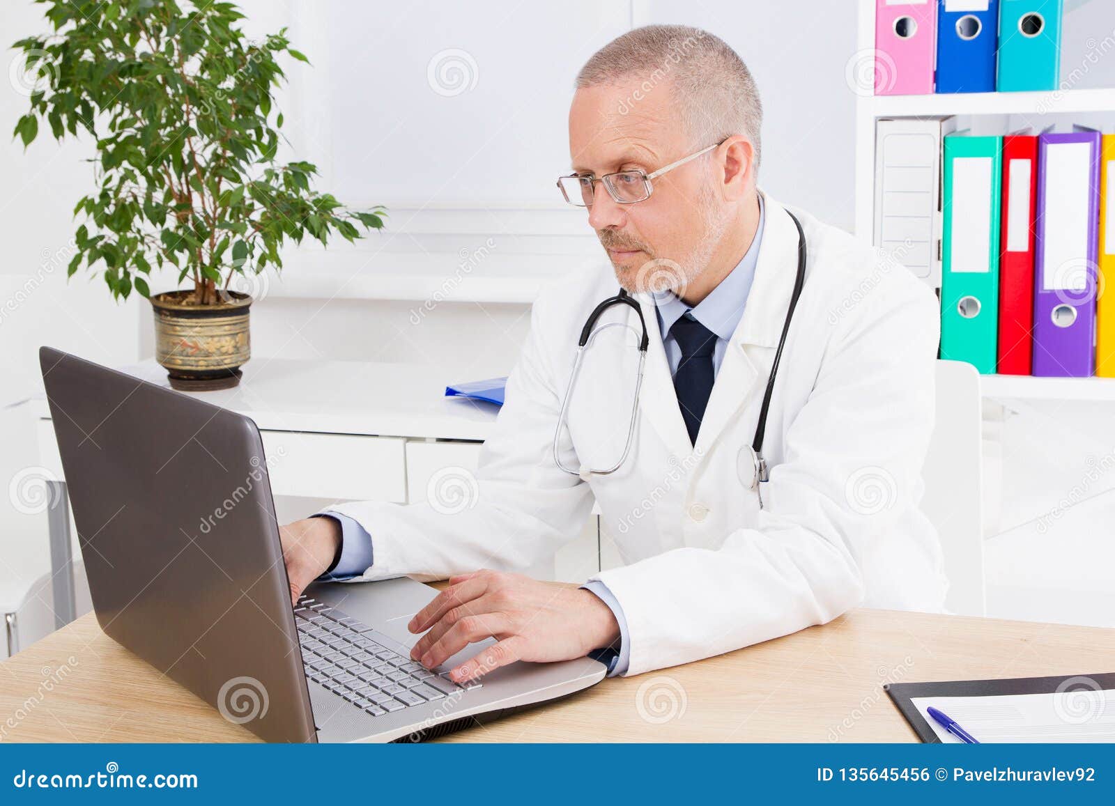 Doctor Works at the Computer in His Office in Clinic Stock Photo ...