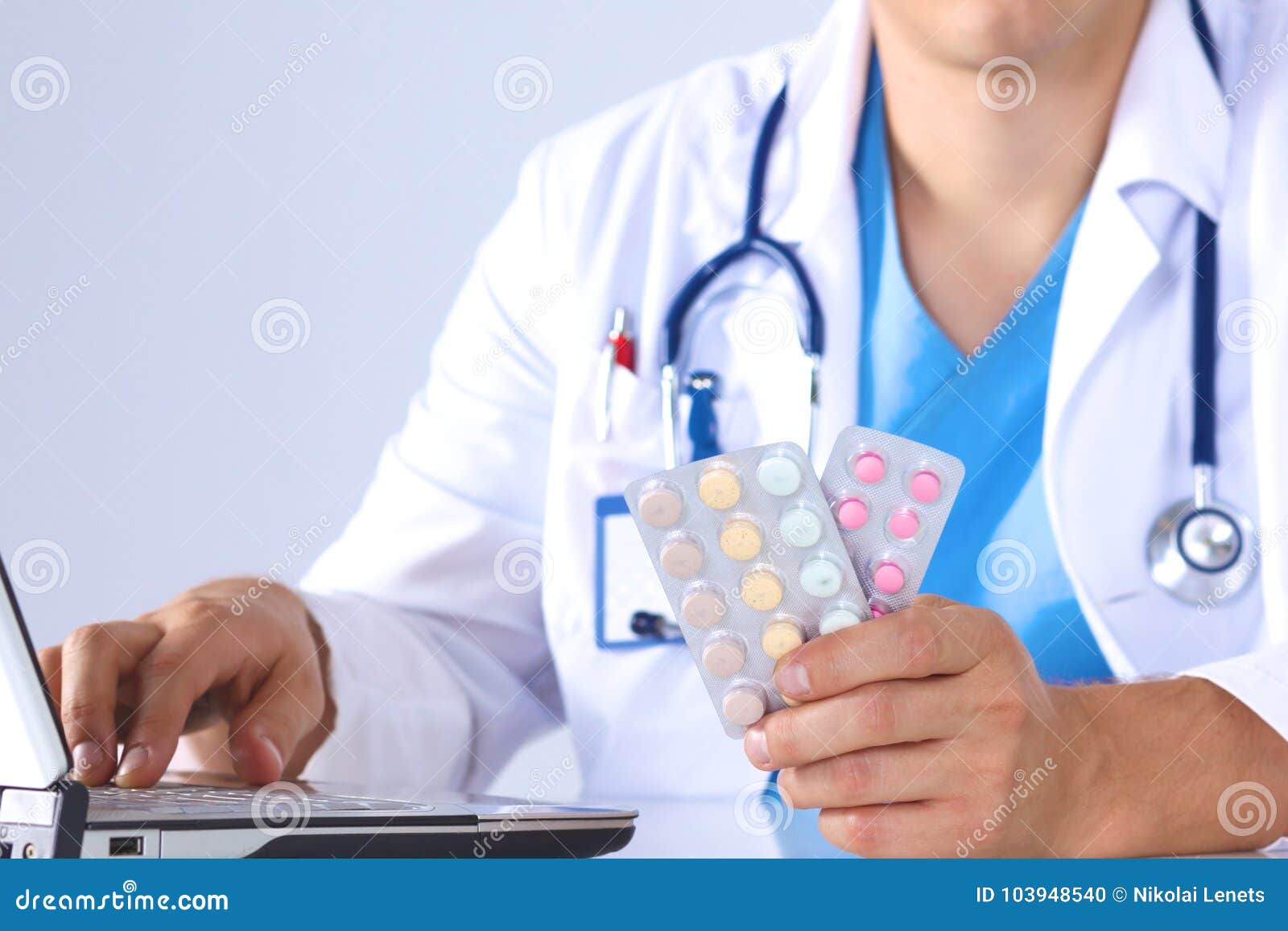 The Doctor Writes a Prescription Pill on the Computer Stock Photo ...