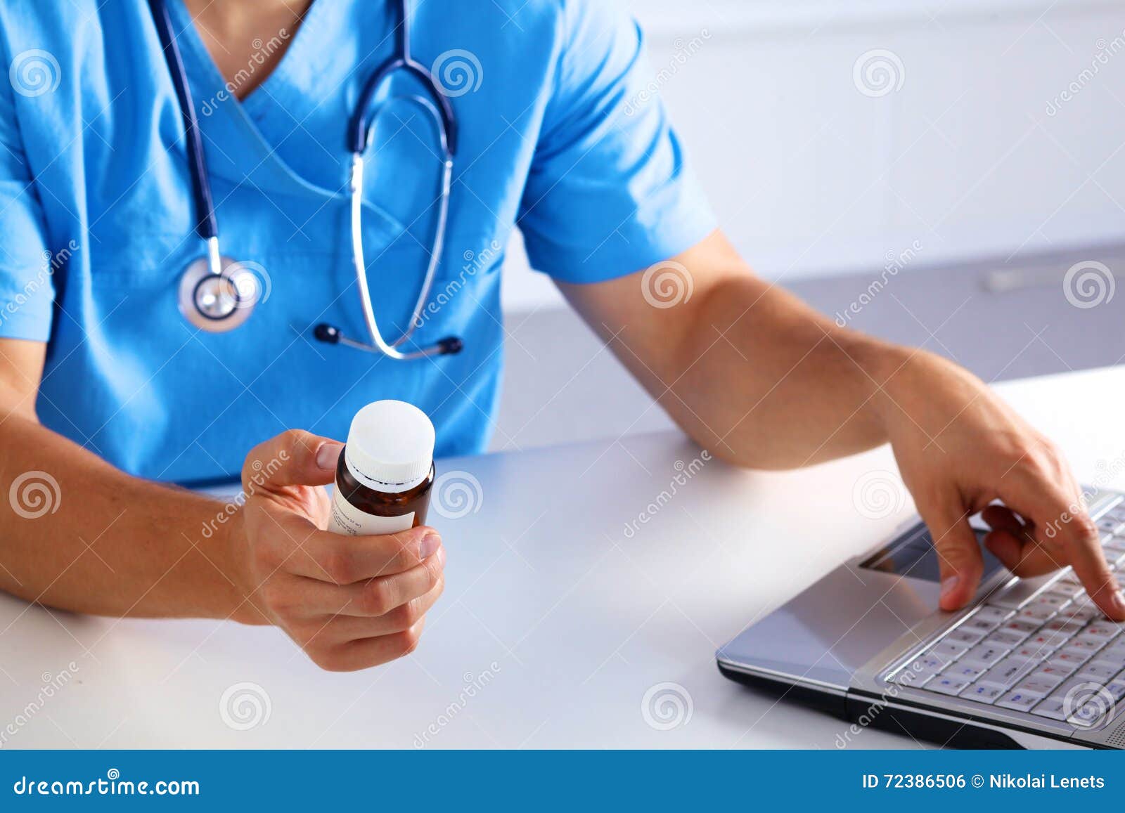 The Doctor Writes a Prescription Pill on the Computer Stock Photo ...
