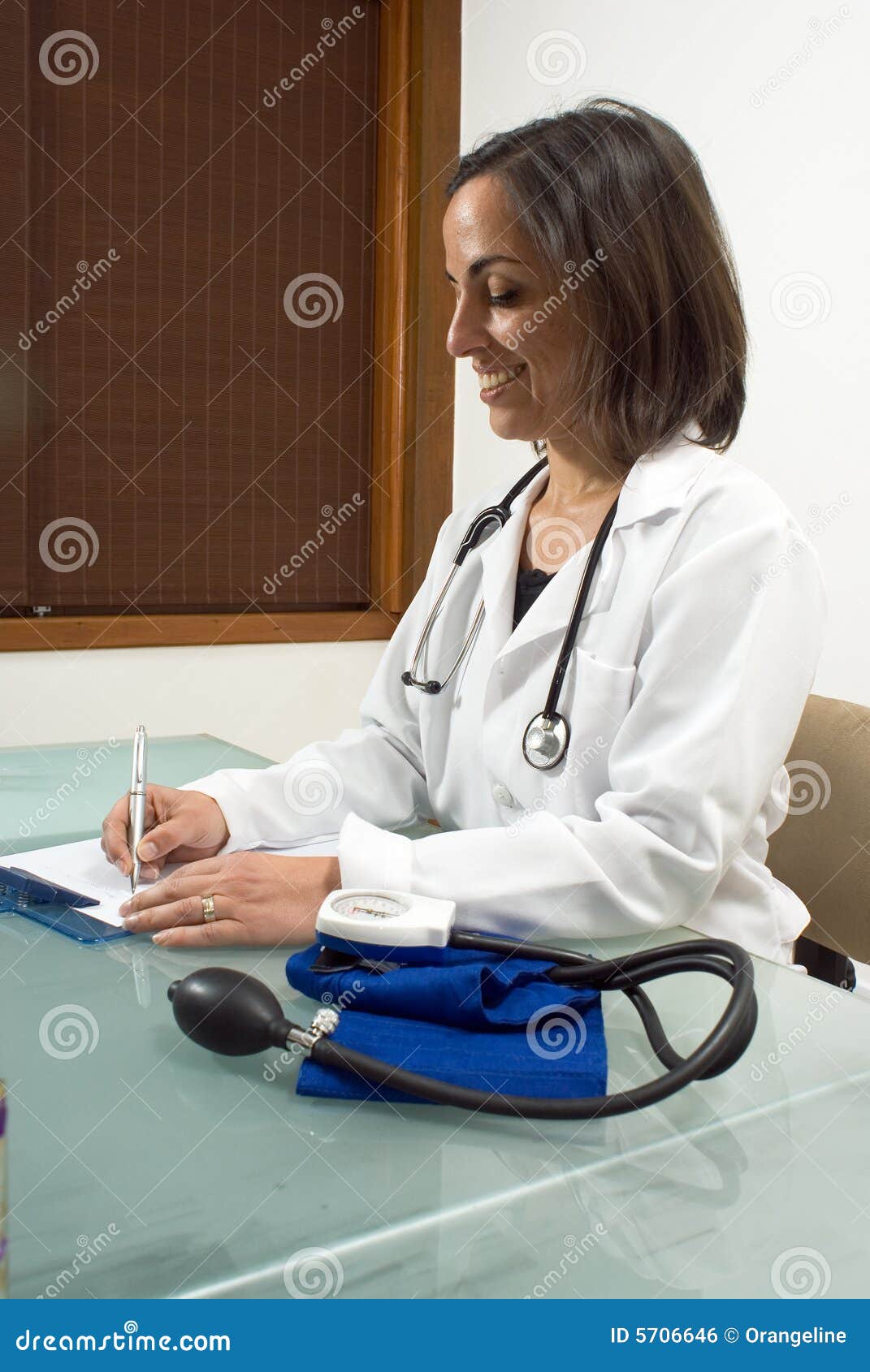 Doctor Writing on Clipboard - Vertical Stock Photo - Image of ...