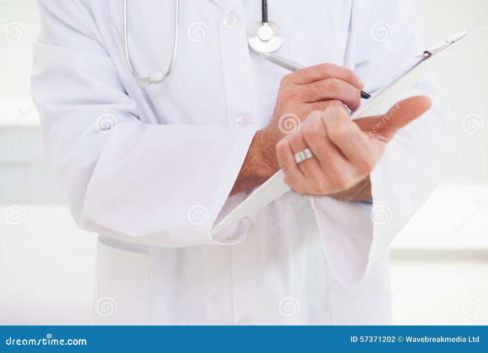 Doctor Writing Down Some Notes Stock Photo - Image of standing, adult ...