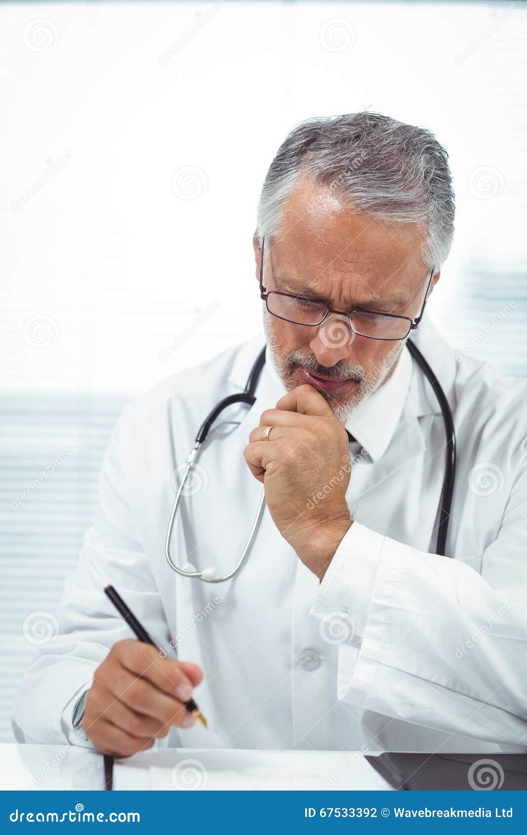 Doctor writing on notepad stock photo. Image of confidence - 67533392