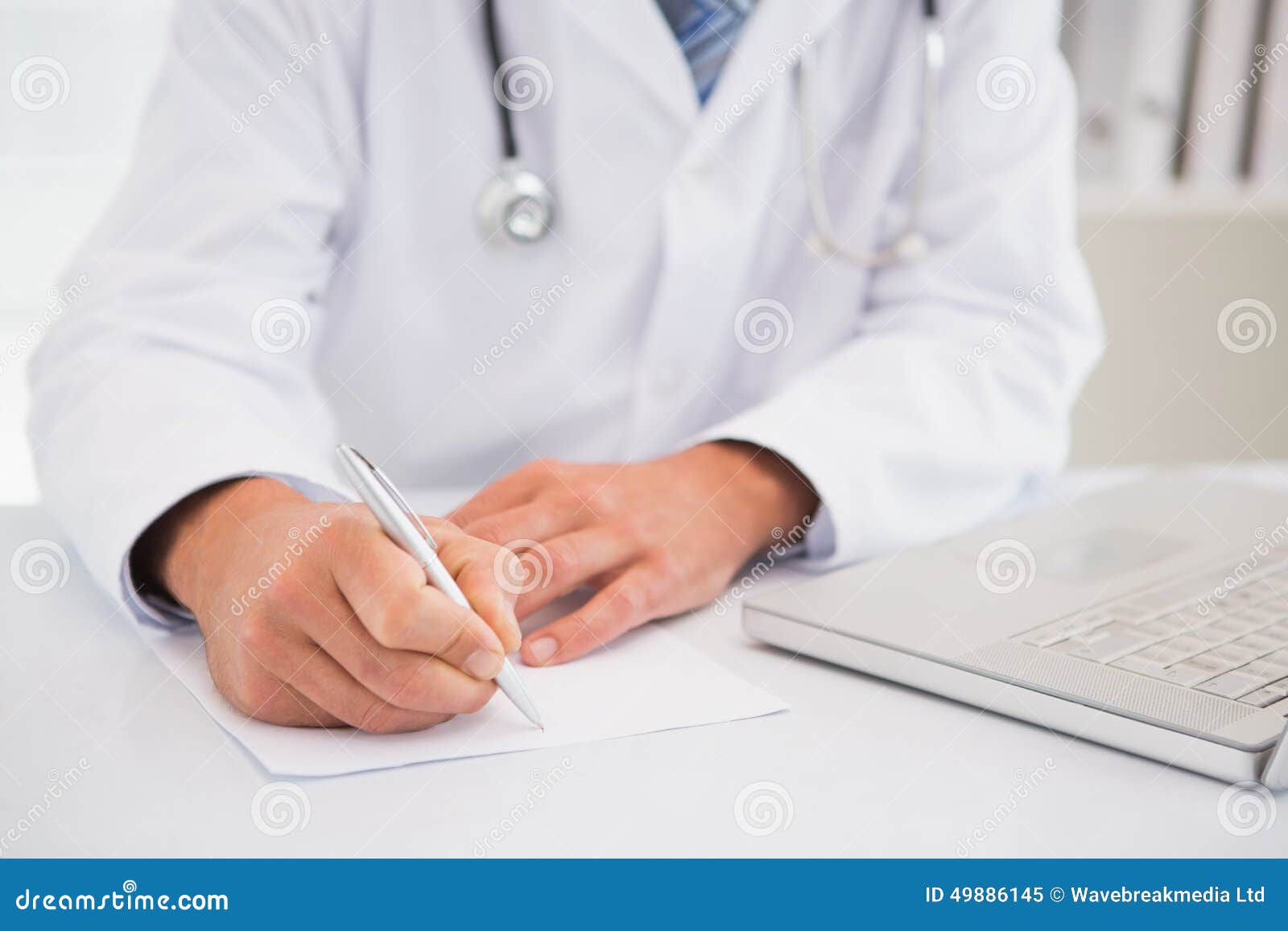 Doctor Writing on a Notepad Stock Image - Image of caucasian, notepad ...