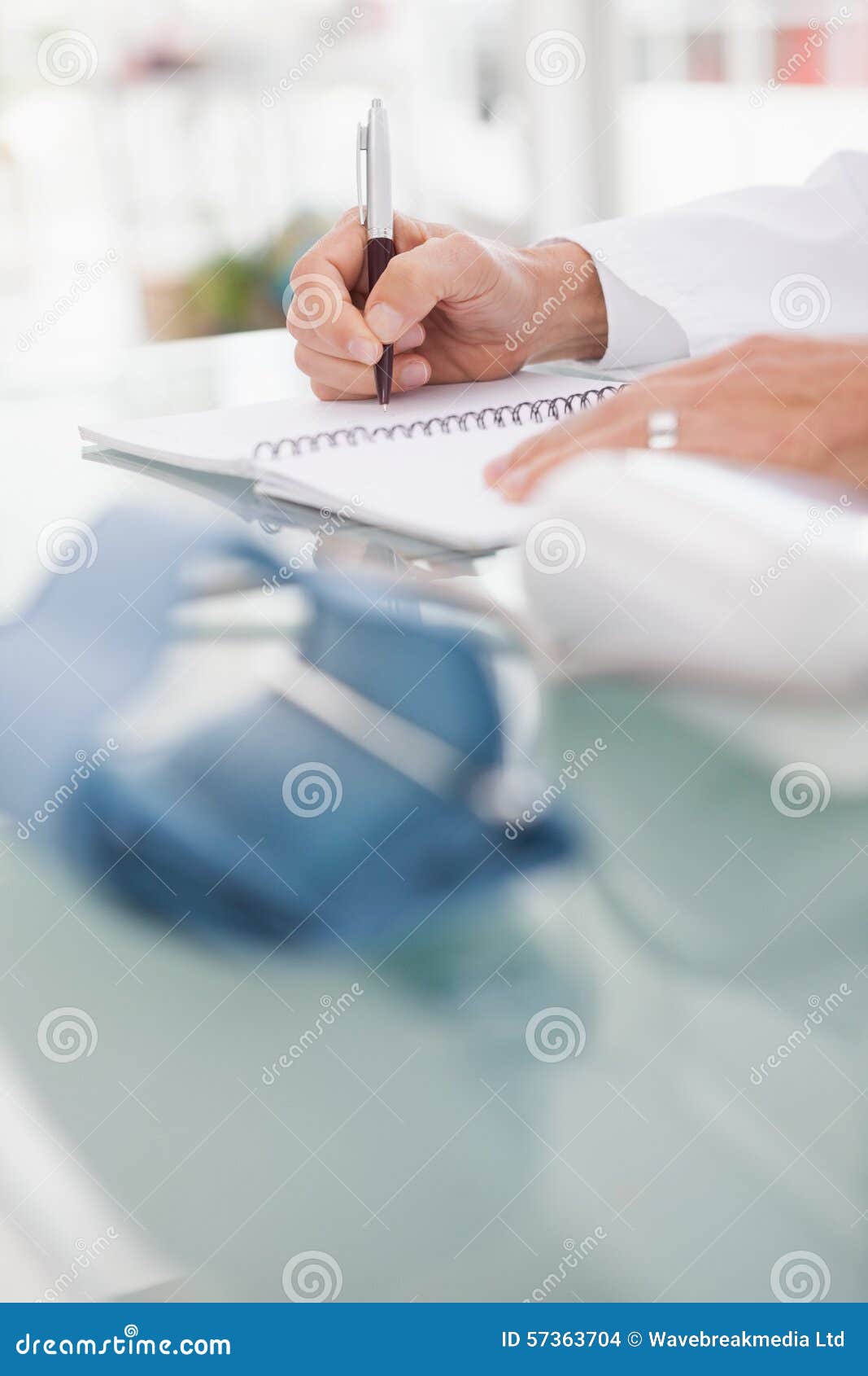 Doctor Writing on a Notepad Stock Photo - Image of closeup, cheerful ...