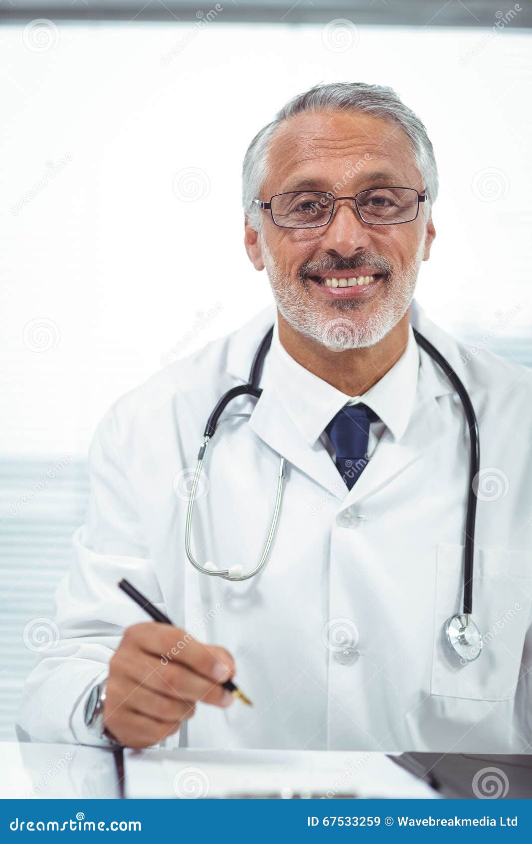 Doctor writing on notepad stock image. Image of male - 67533259