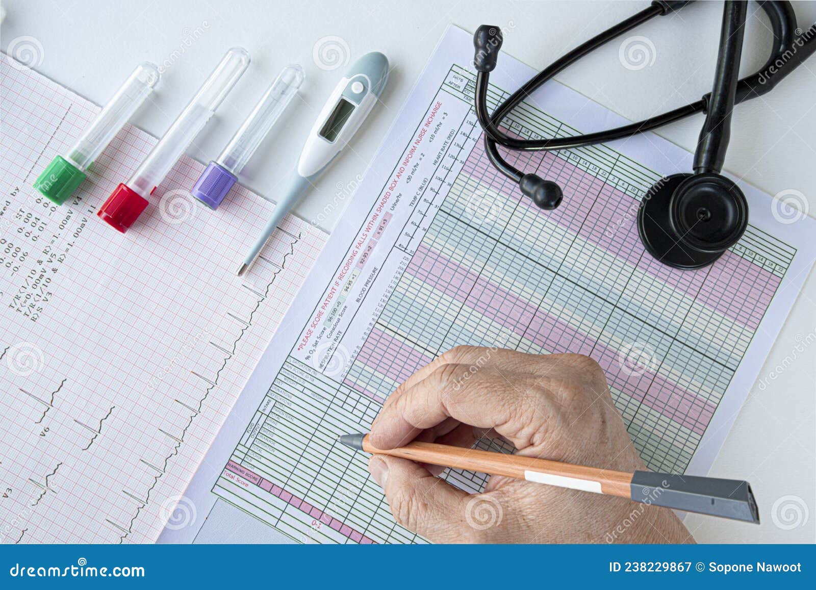 A Doctor Writing on a Vital Signs Chart Stock Image - Image of ...