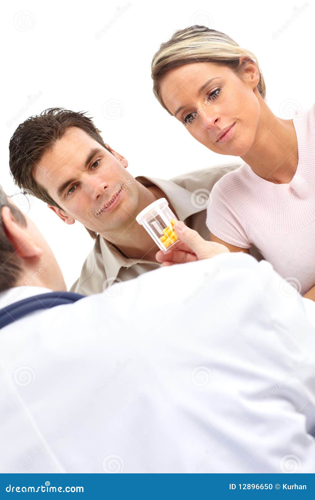 Doctor and young couple stock photo. Image of family - 12896650