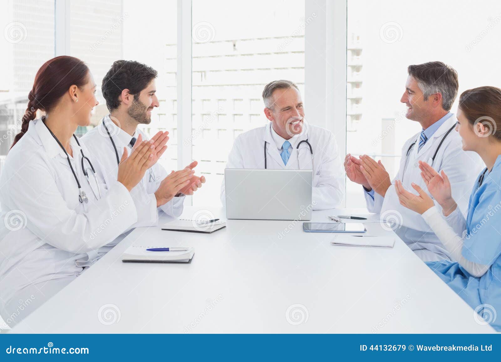 Doctors Applauding a Fellow Doctor Stock Image - Image of specialist ...