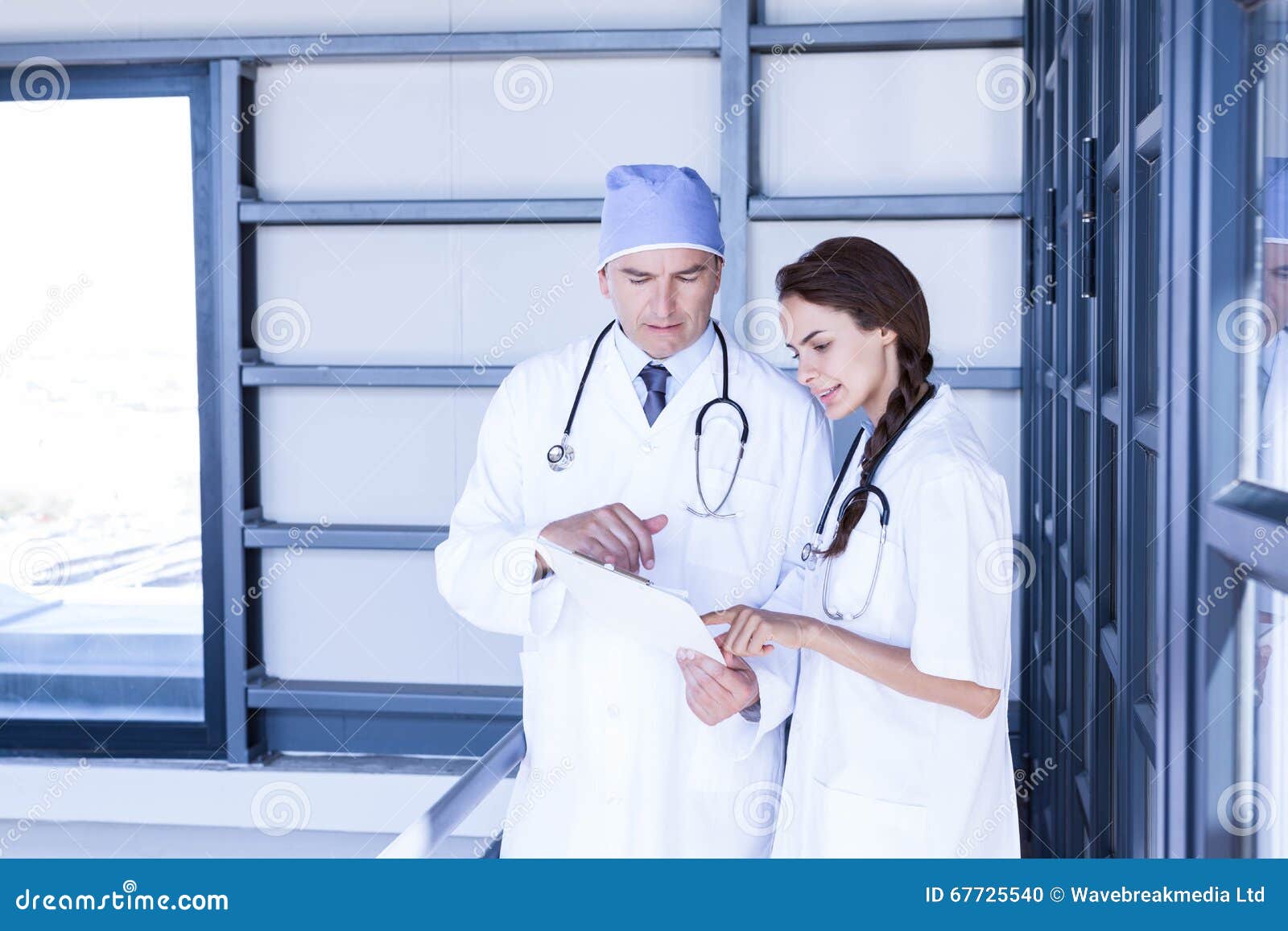 Doctors Checking a Medical Report Stock Photo - Image of checking ...