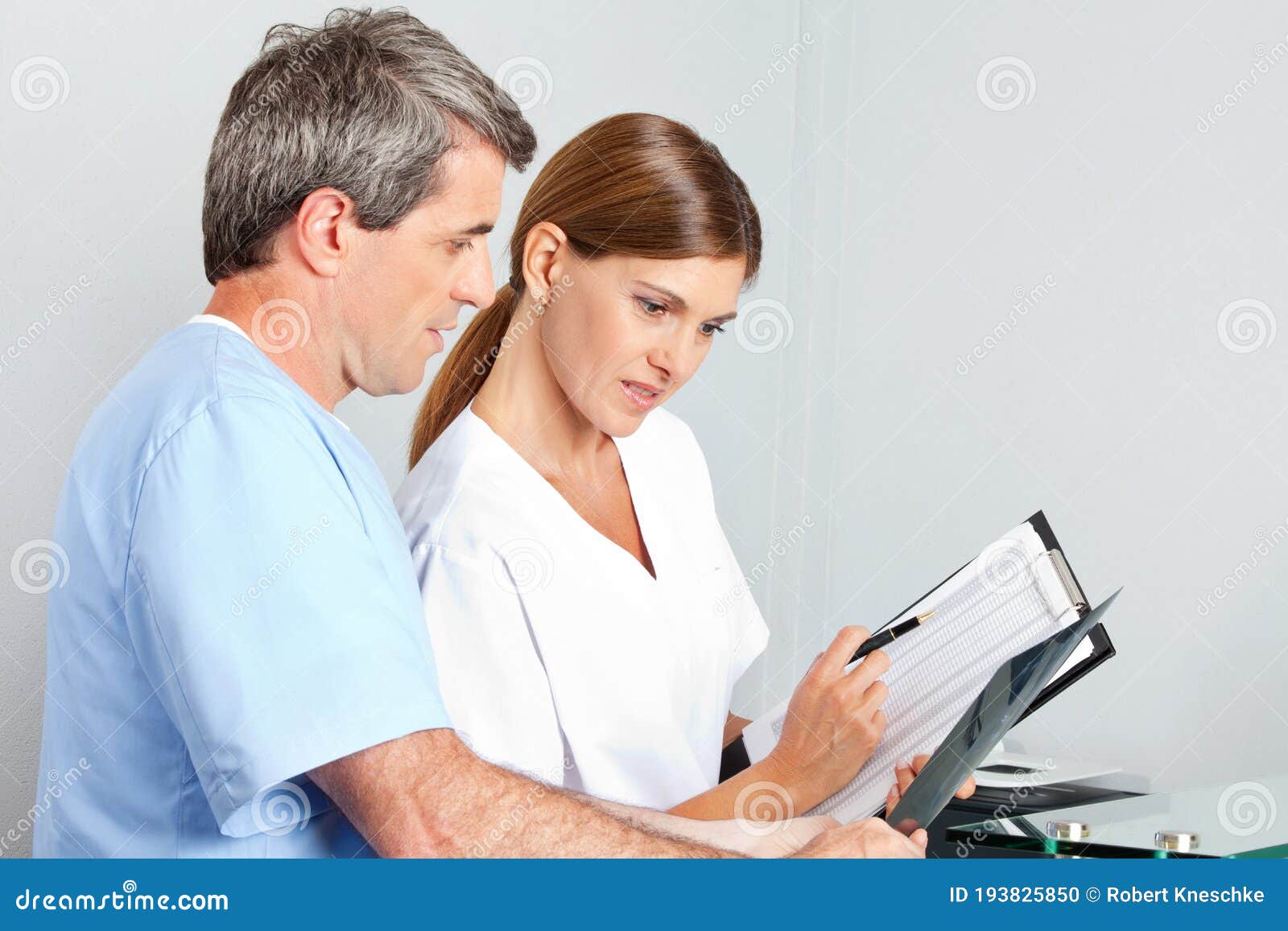 Doctors discuss findings stock photo. Image of examine - 193825850