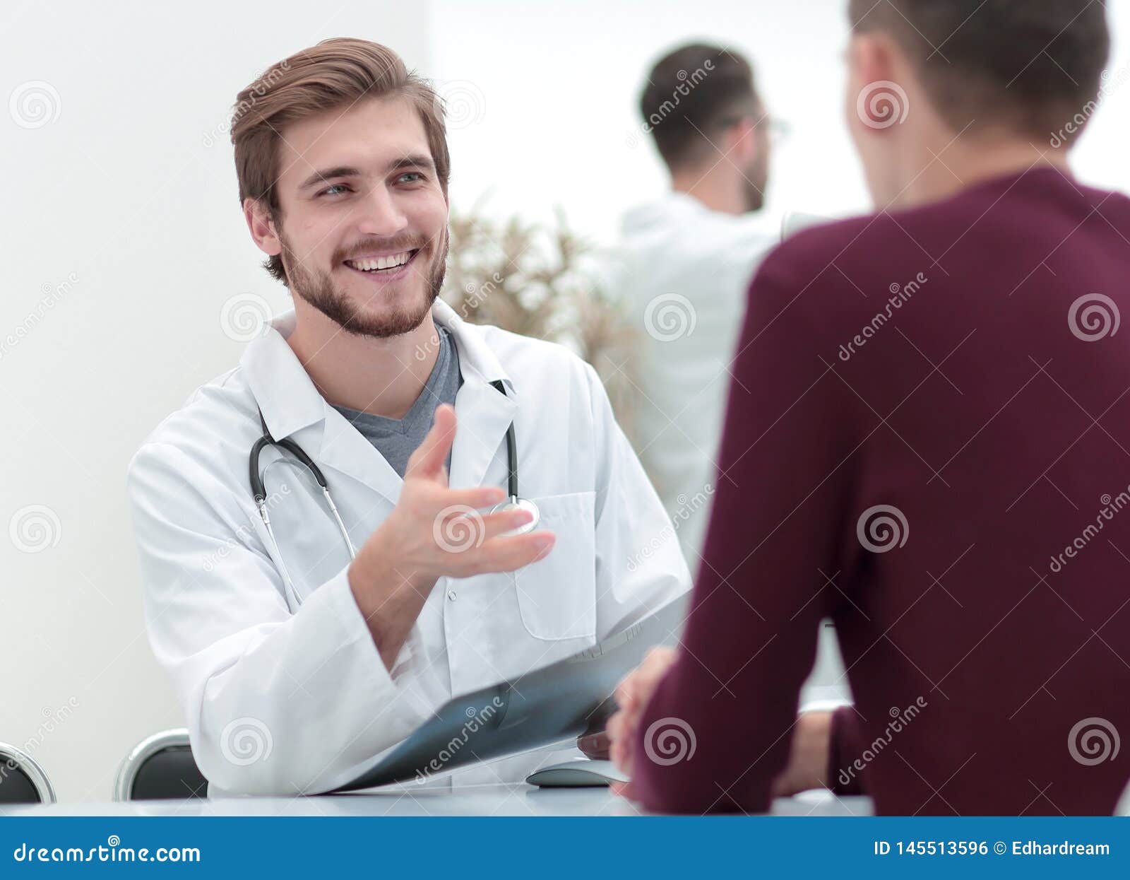 Doctors Discuss with the Patient the X-ray Stock Photo - Image of ...