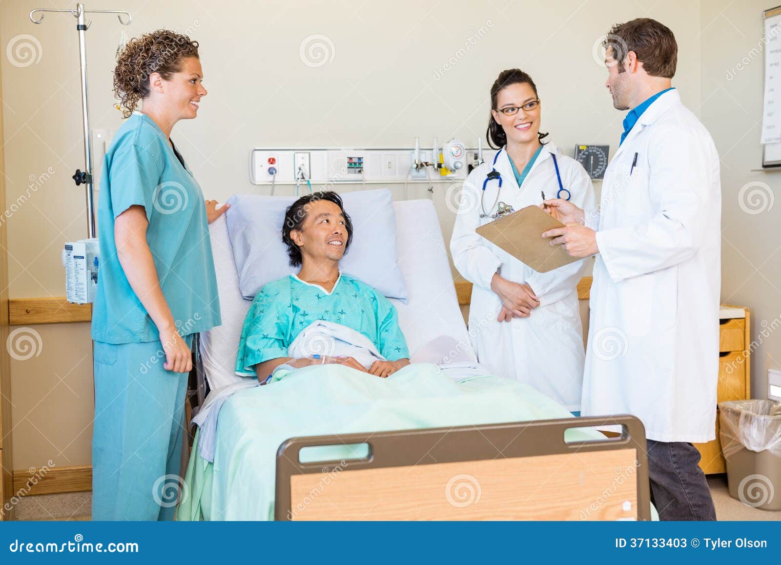 Doctors Discussing Report while Nurse and Patient Stock Image - Image ... Doctors Discussing Report while Nurse and Patient Stock Image - Image ...