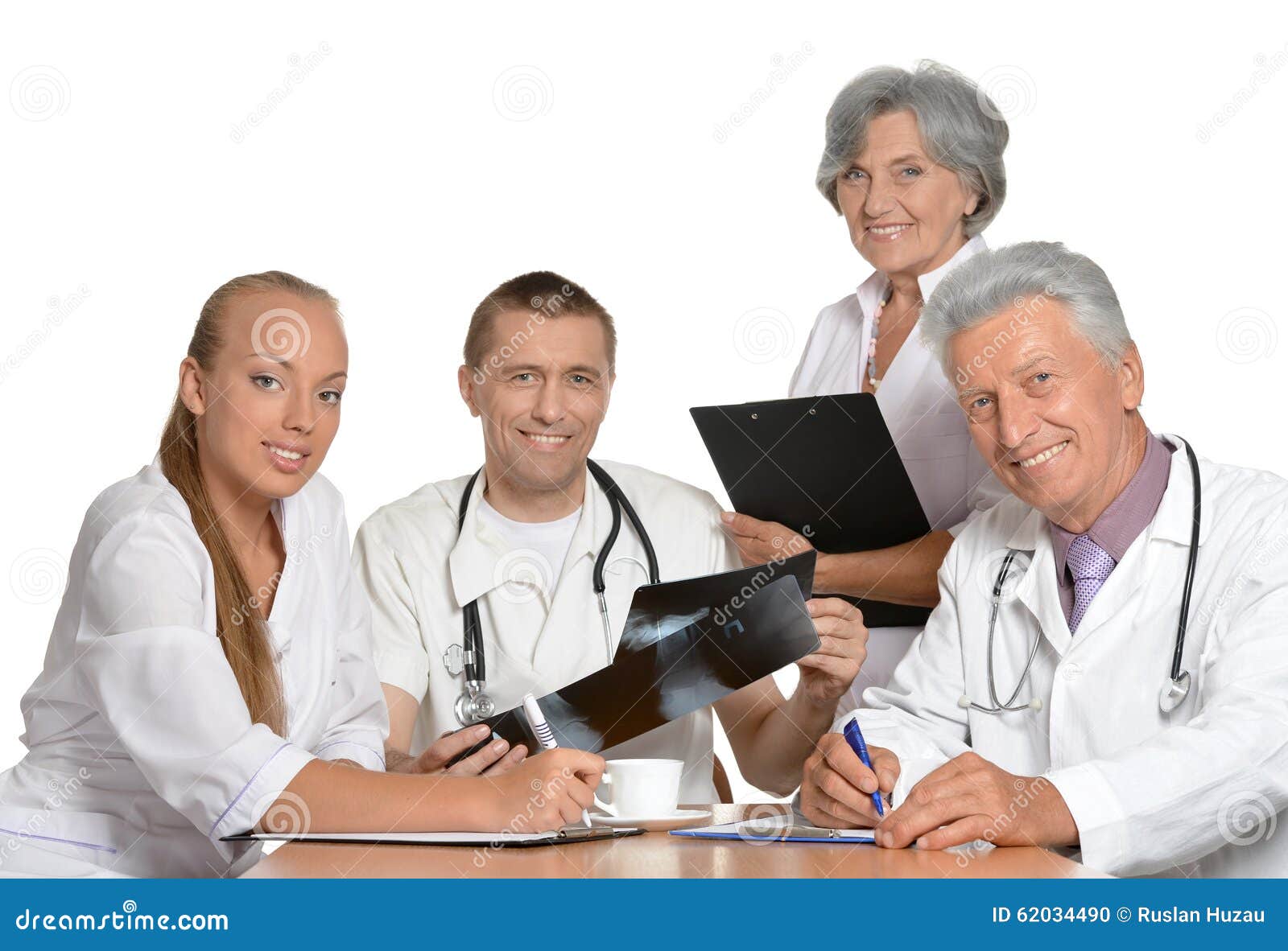 Doctors Discussing at Table Stock Photo - Image of caucasian ...