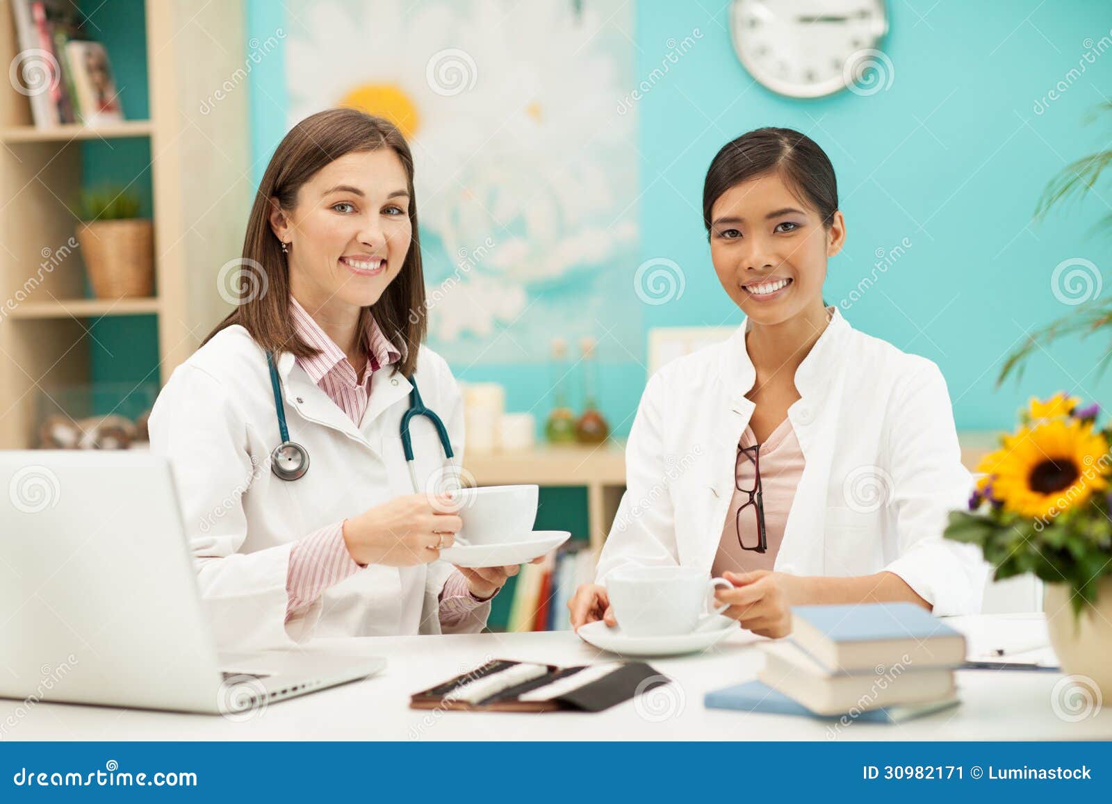 Doctors Drinking Coffee stock image. Image of laptop - 30982171