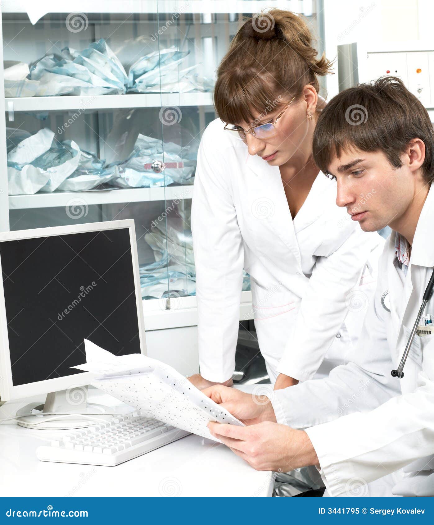 Doctors examining chart stock image. Image of hospital - 3441795