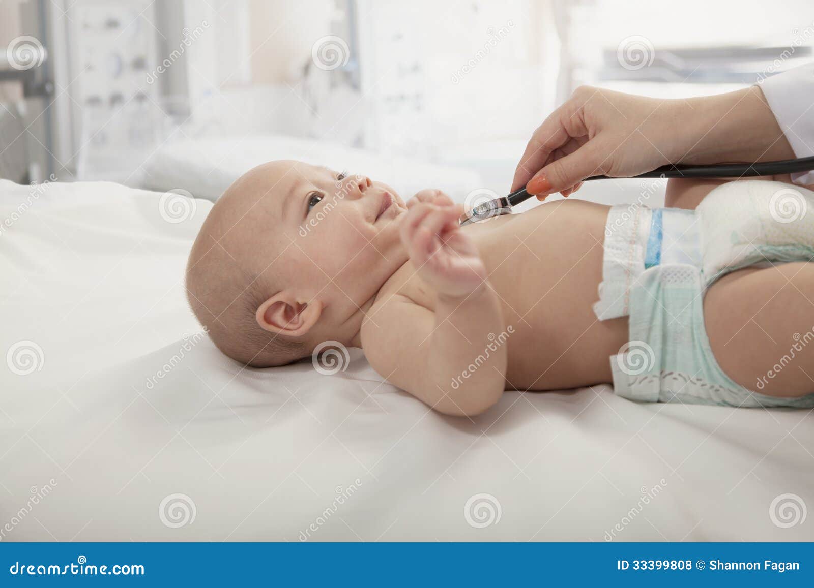 Doctors Hand Checking the Heartbeat of a Baby, Close-up Stock Photo ...