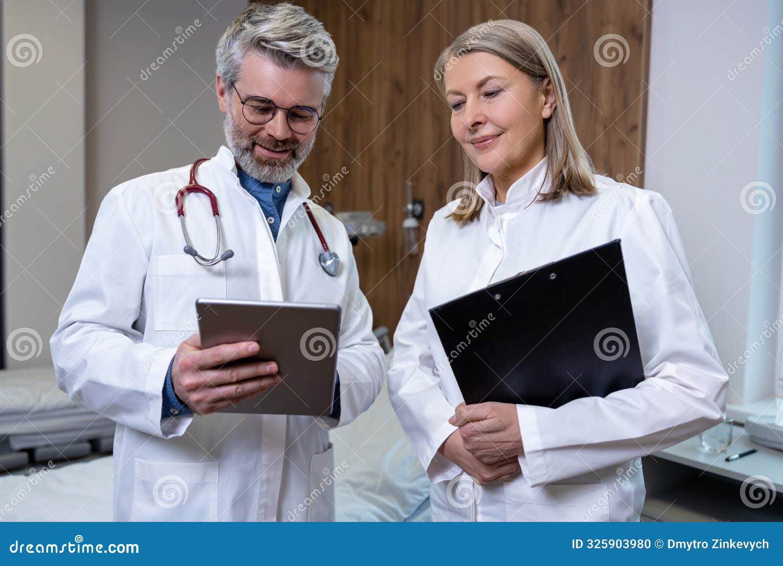 Doctors Having a Changeover in a Clinic and Sharing Information Stock ...