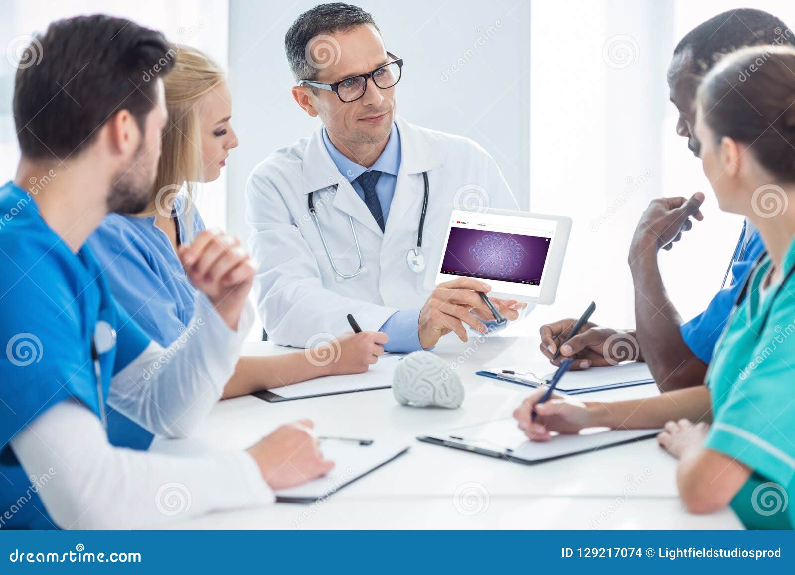 Doctors Having Conversation and Looking at Tablet Editorial Stock Image ...