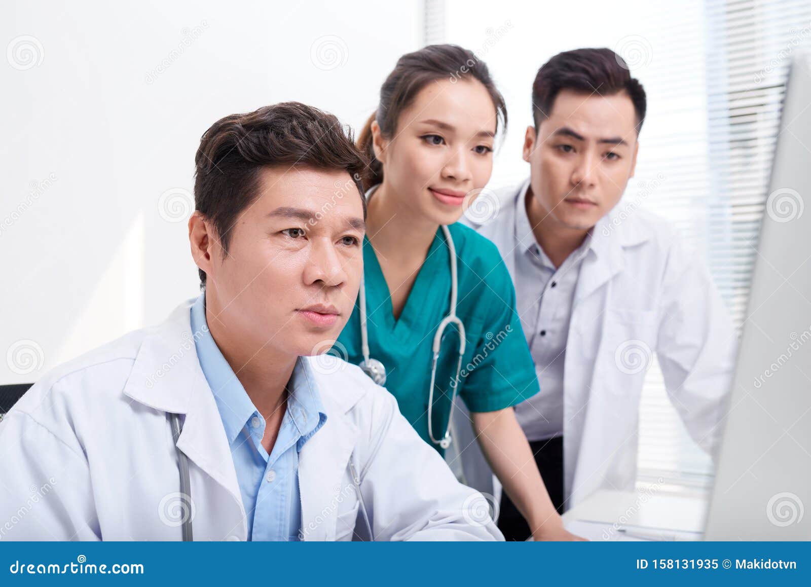 Doctors Having a Medical Discussion in Office Stock Image - Image of ...
