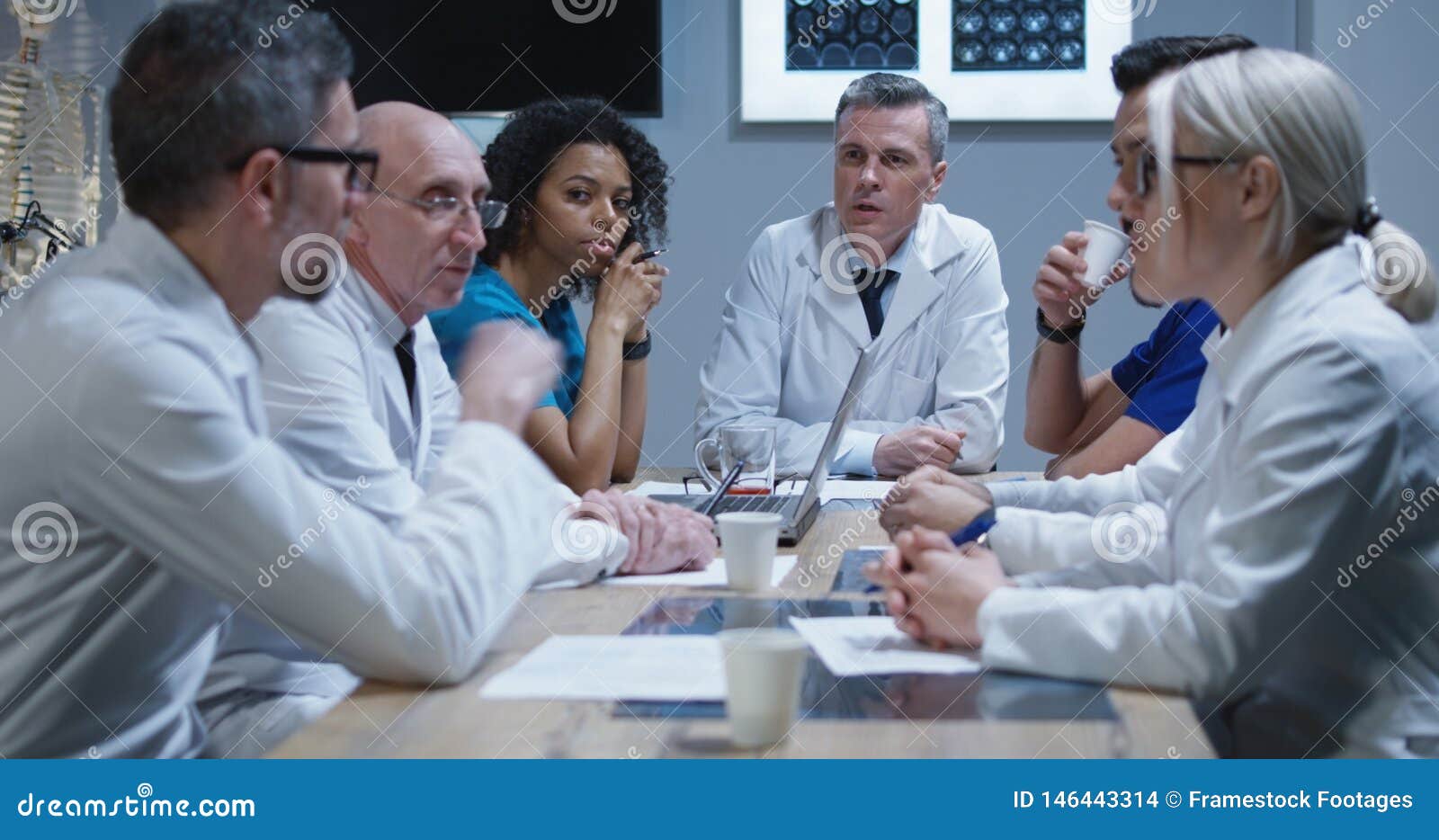 Doctors having a meeting stock photo. Image of sitting - 146443314