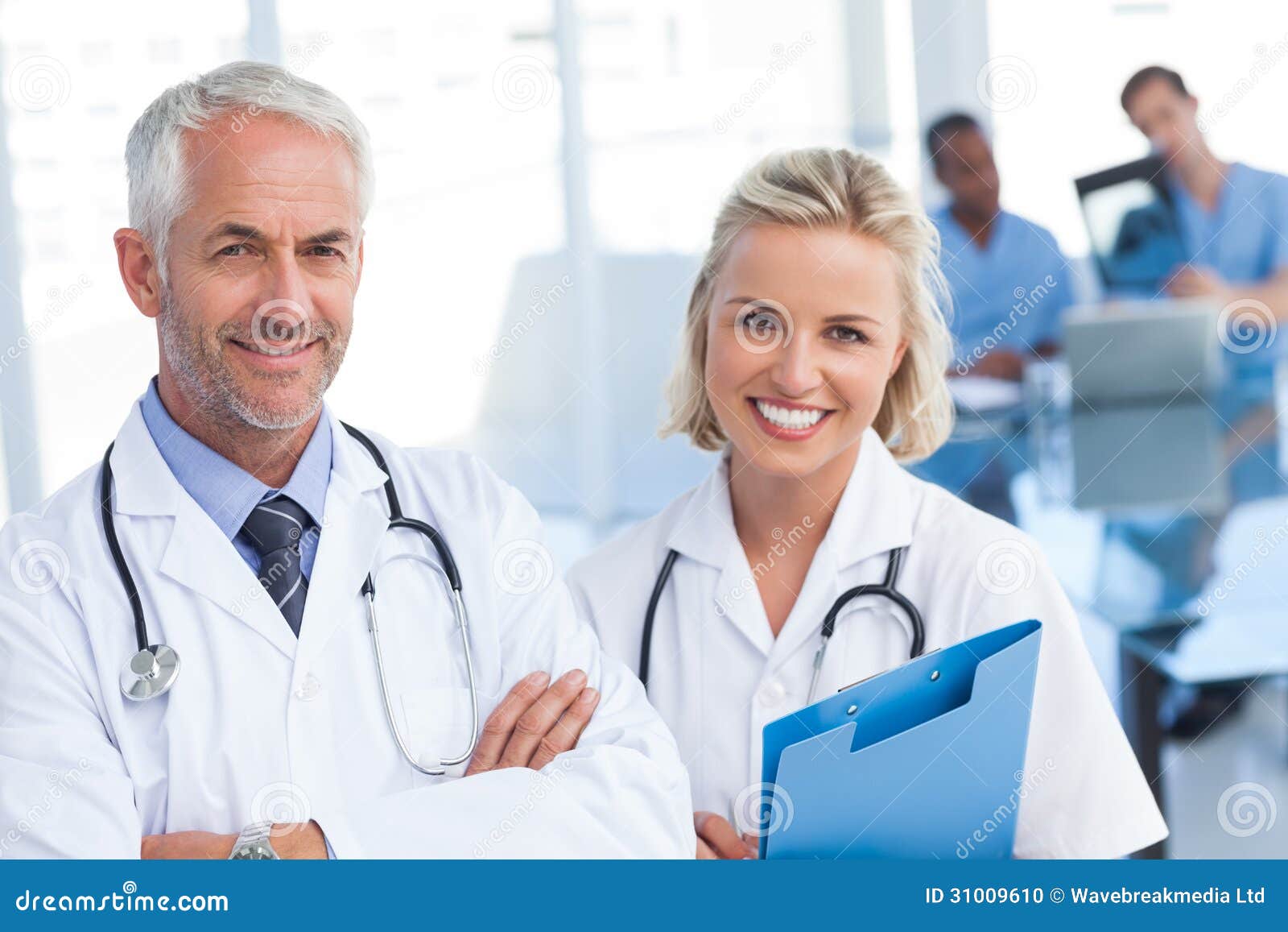 Doctors holding blue file stock photo. Image of file - 31009610