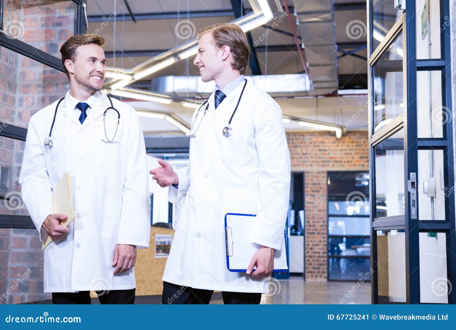 Doctors Interacting with Each Other Stock Image - Image of indoors ...