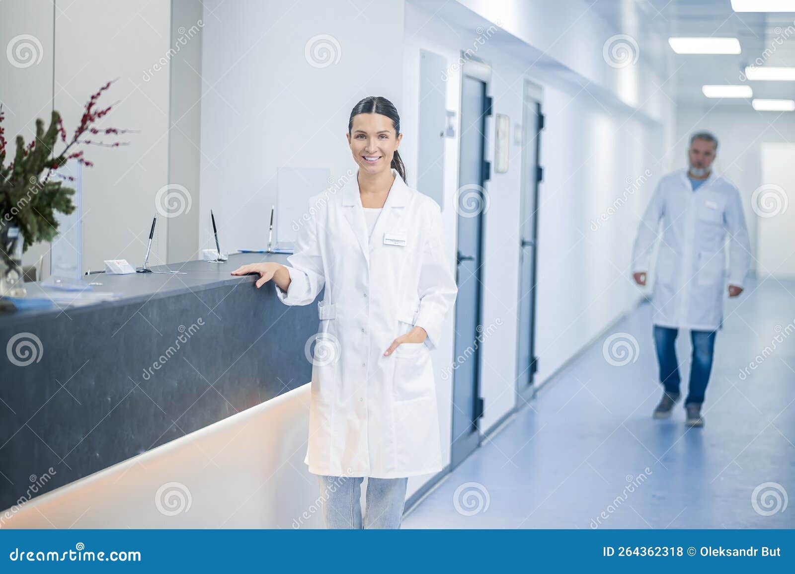 Doctors in Lab Coats in the Clinic Corridor Stock Photo - Image of ...
