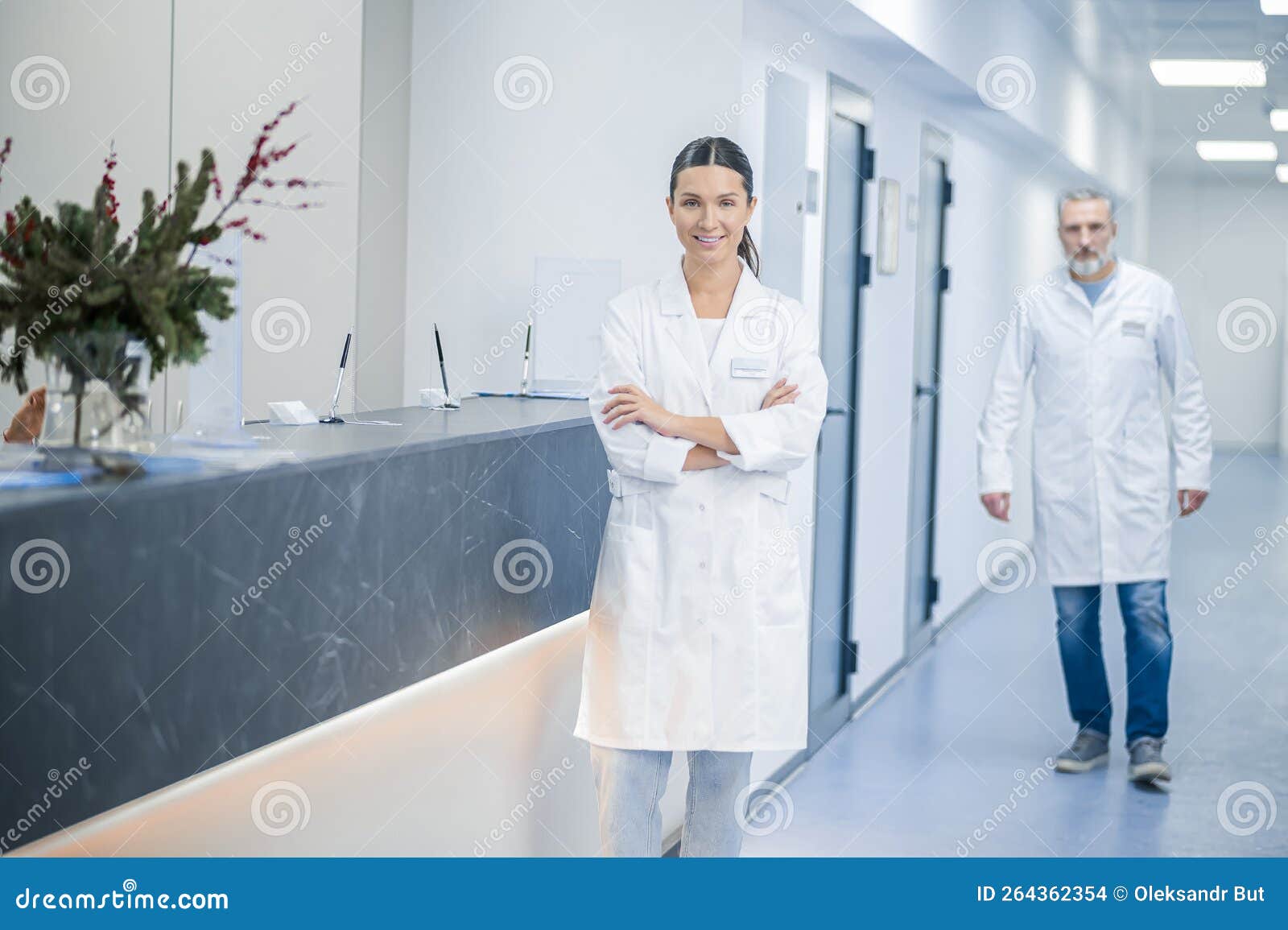 Doctors in Lab Coats in the Clinic Corridor Stock Photo - Image of ...
