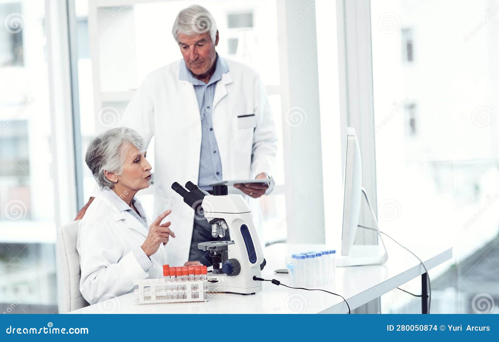 We Doctors always Lend a Helping Hand. Two Focused Elderly Scientists ...