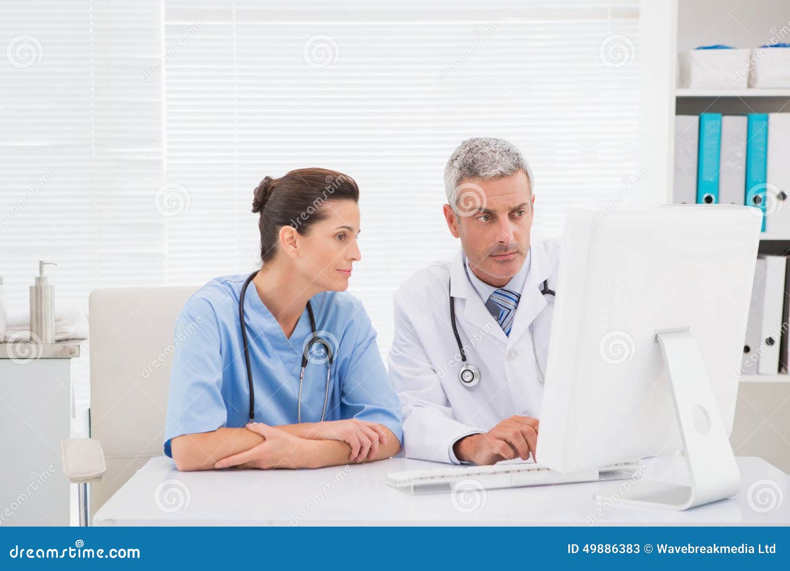 Doctors Looking at Computer Stock Image - Image of caucasian ...