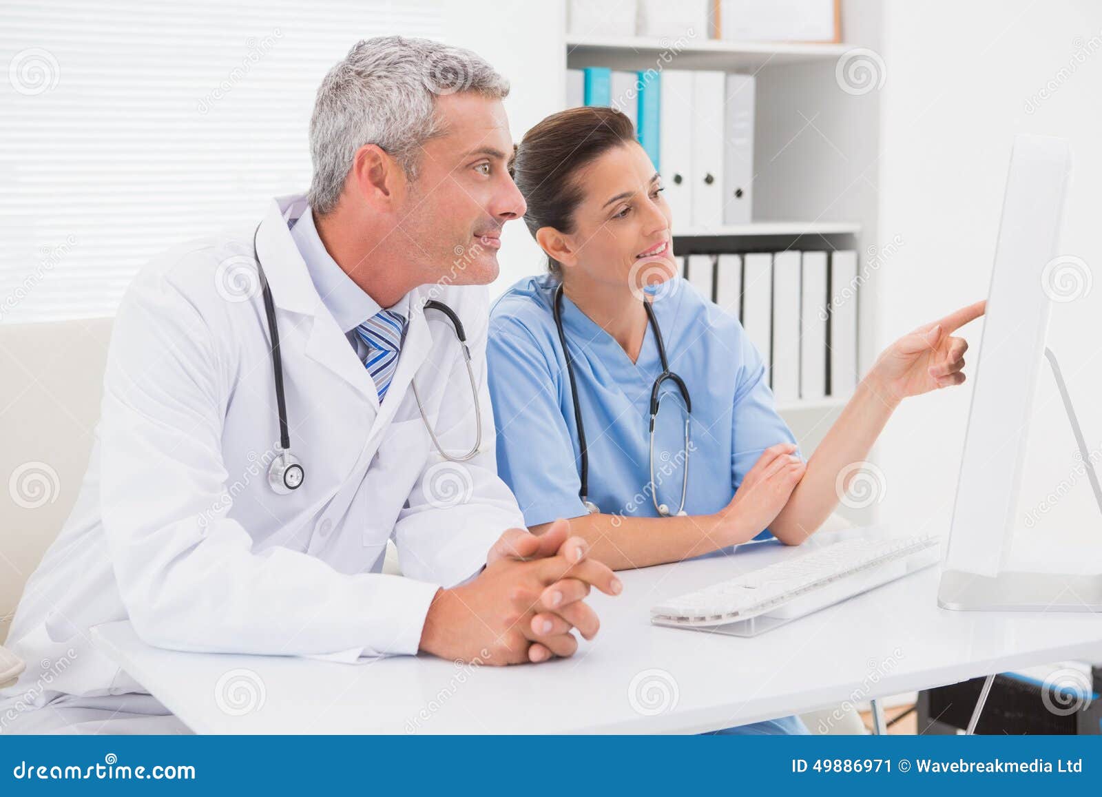 Doctors Looking at Computer Stock Image - Image of monitor, caucasian ...