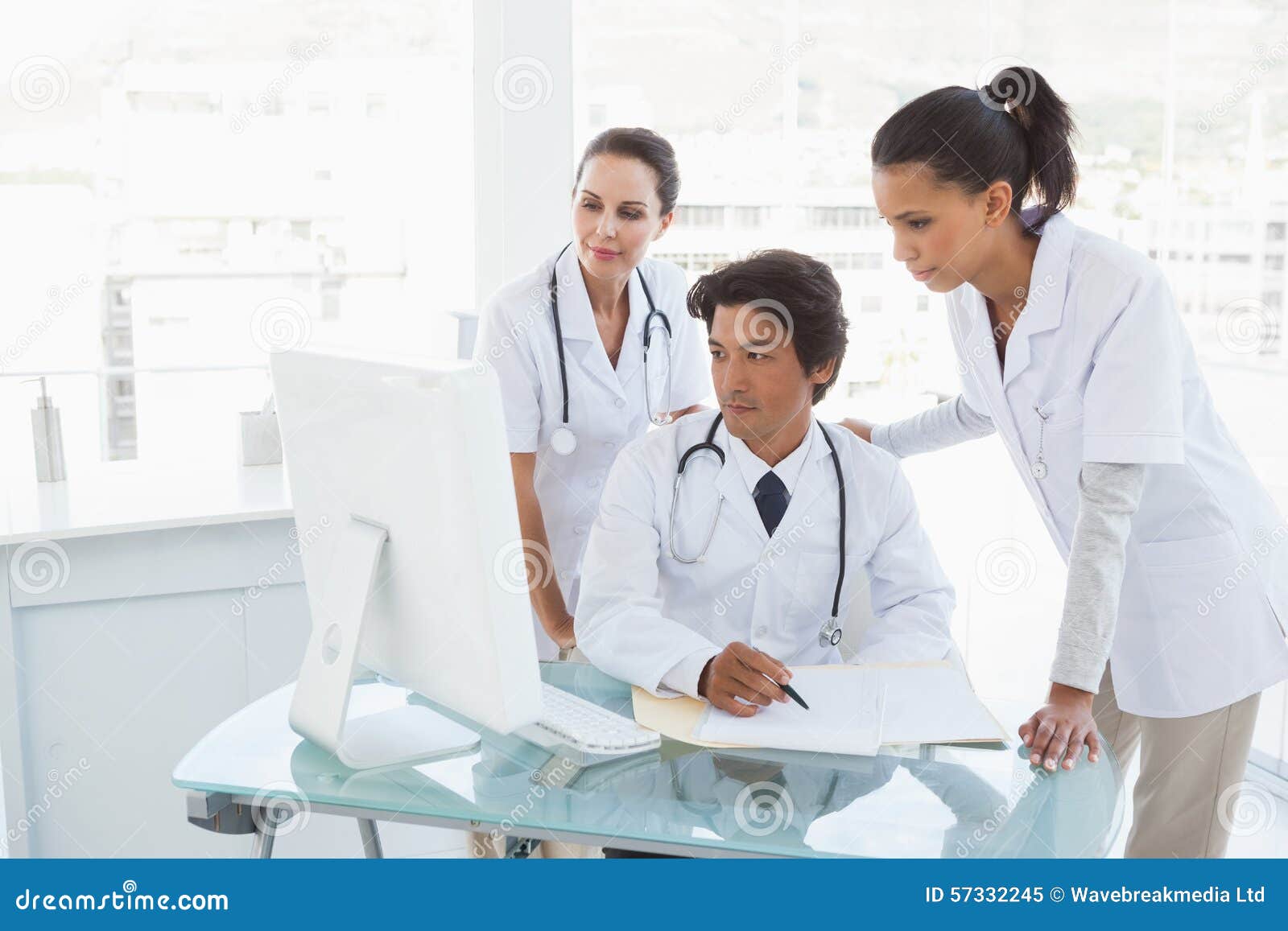 Doctors Looking at a Computer Stock Image - Image of arms, hospital ...